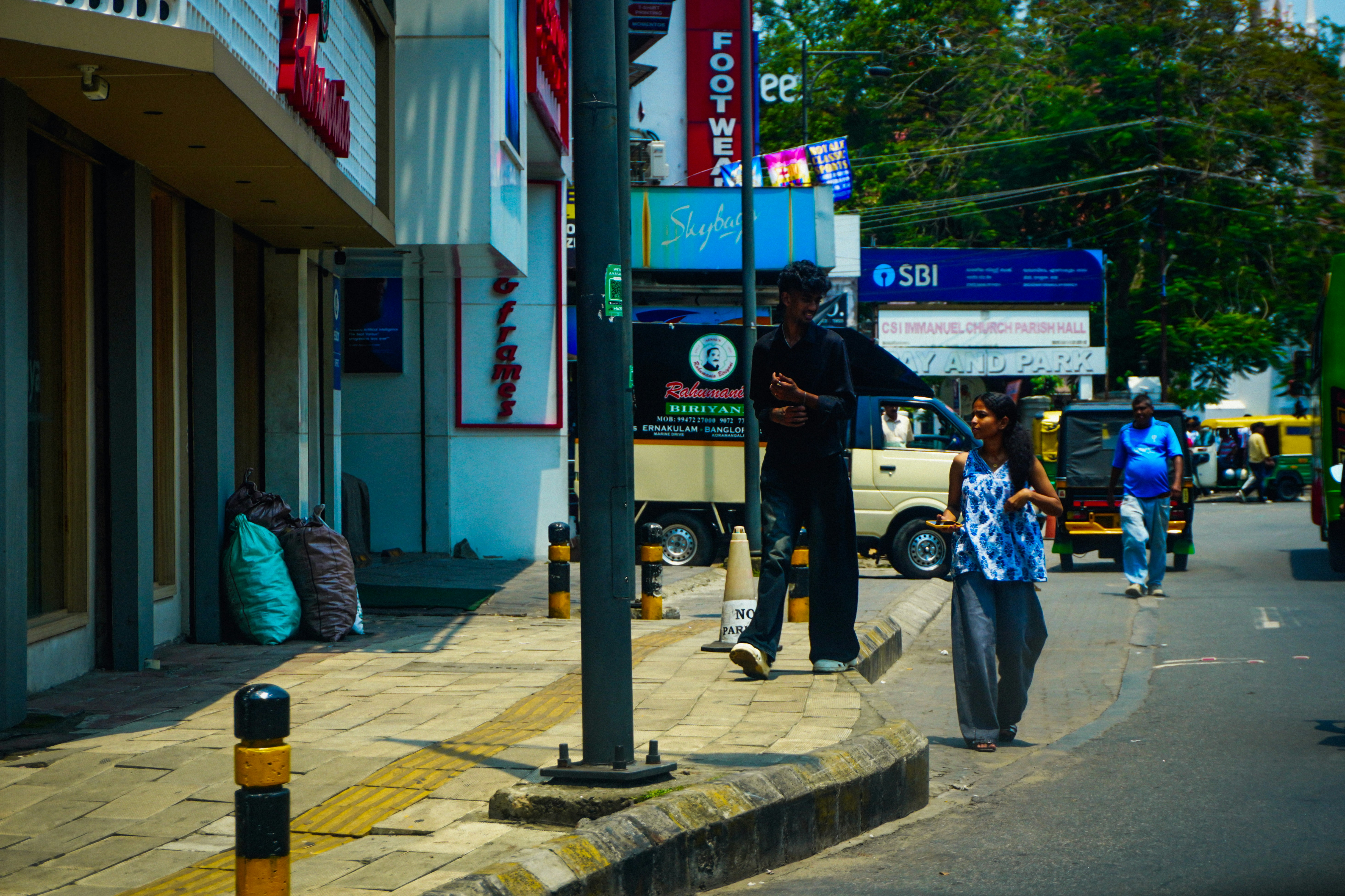 City Street Portrait: Man with Child at a Bus Stop