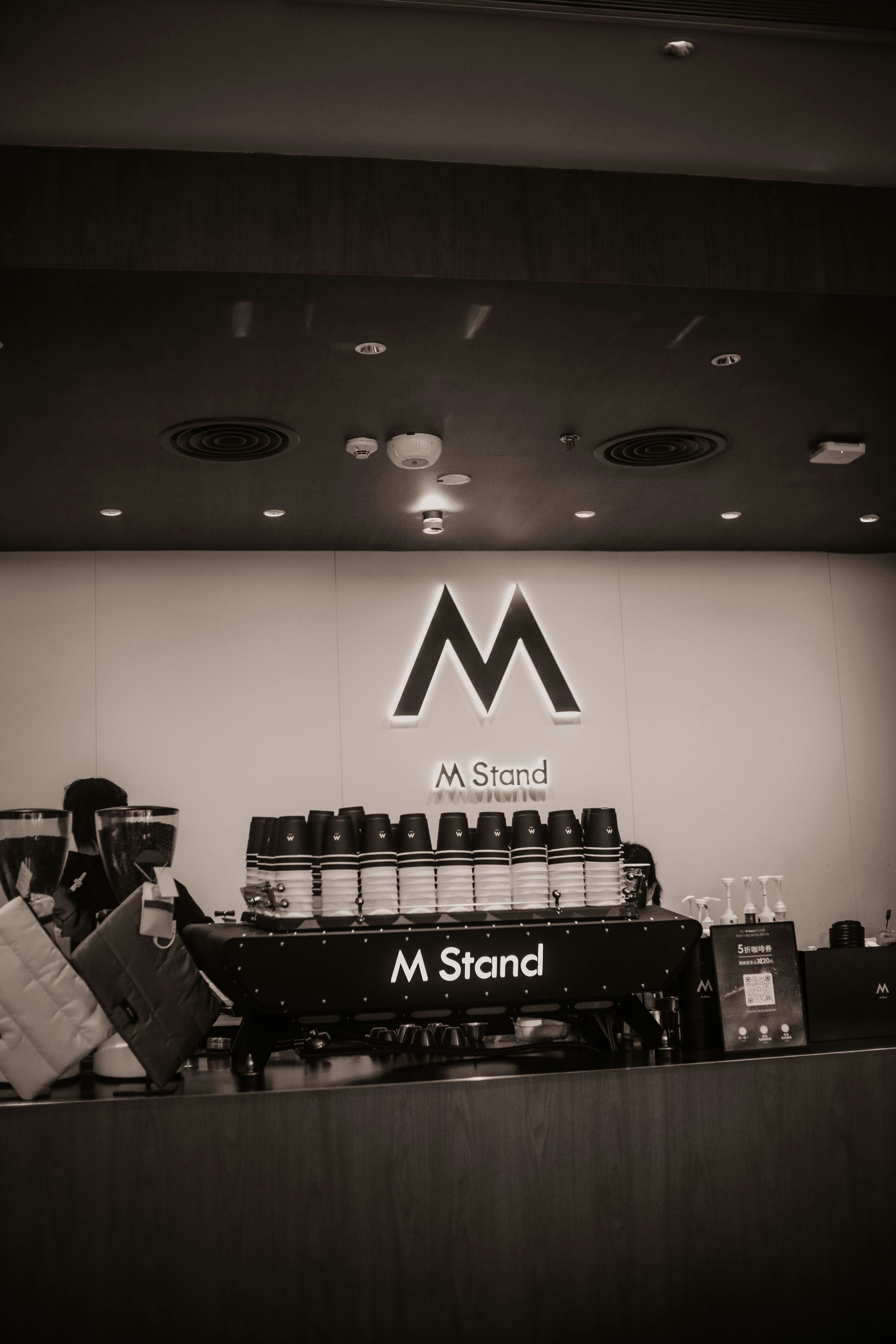 M Stand Café Counter Under Bold Monogram