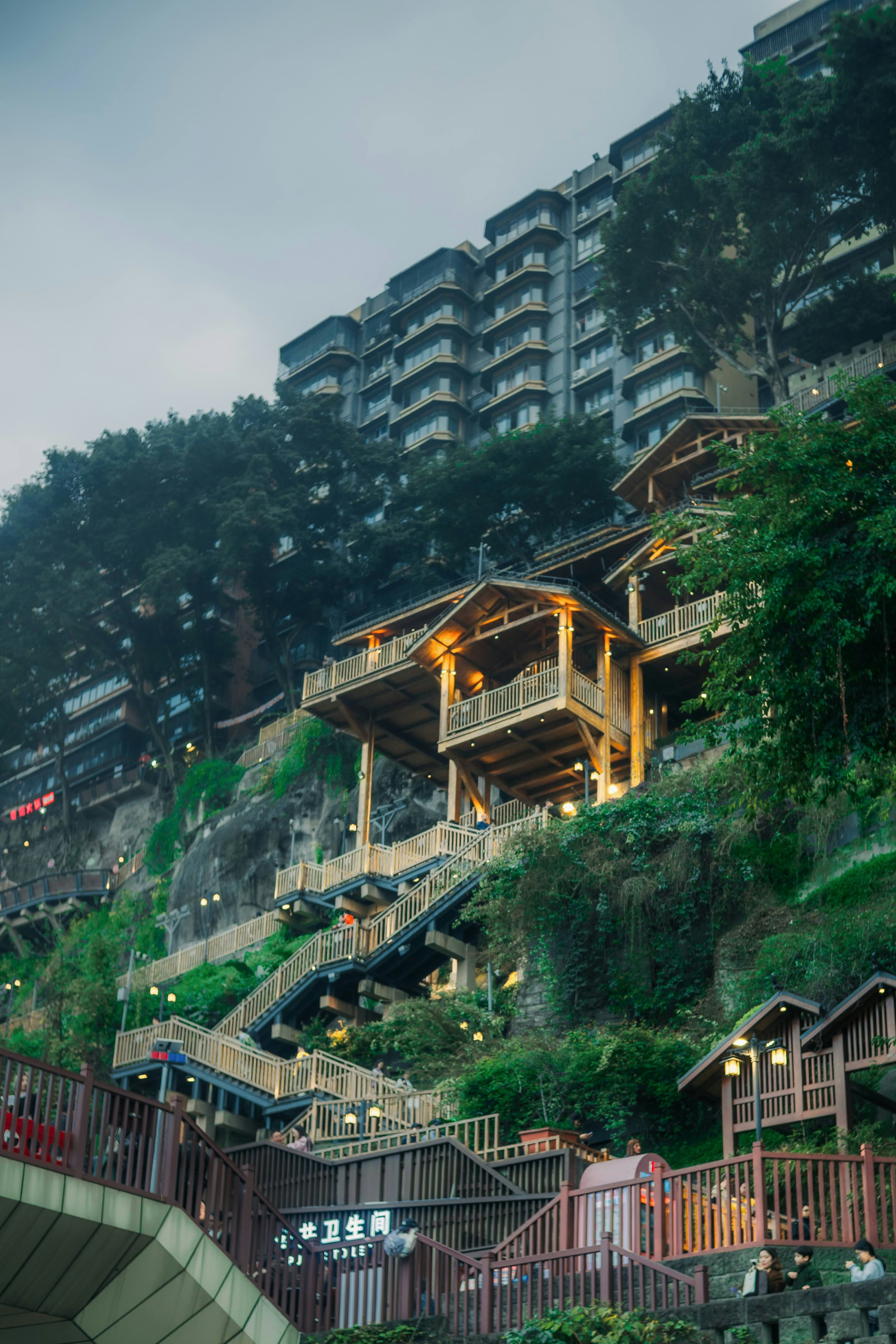 Terraced lodge cantilevered along a hillside among lush trees