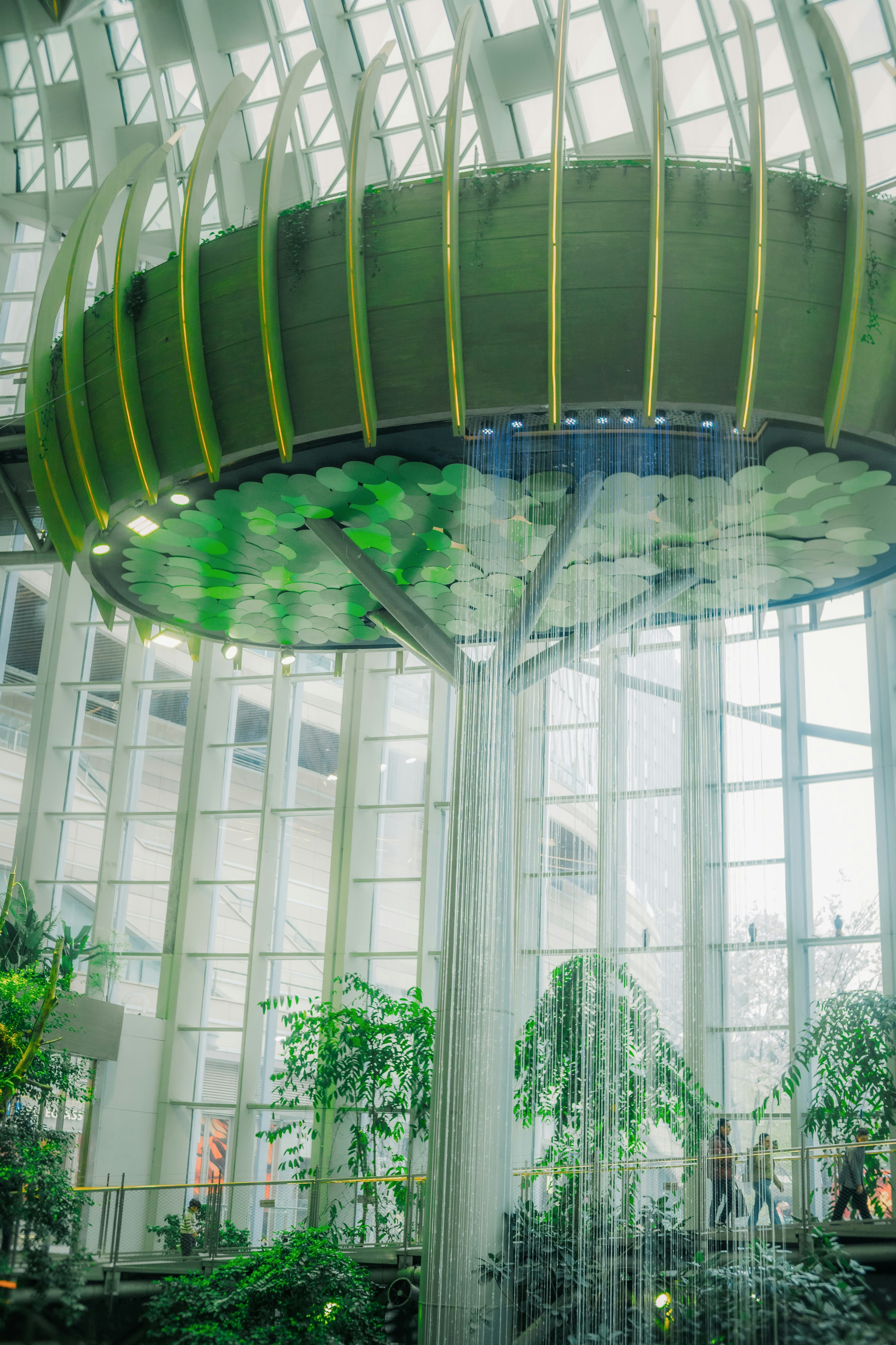 Indoor Green Canopy: A Circular Cascade Above a Glass Atrium
