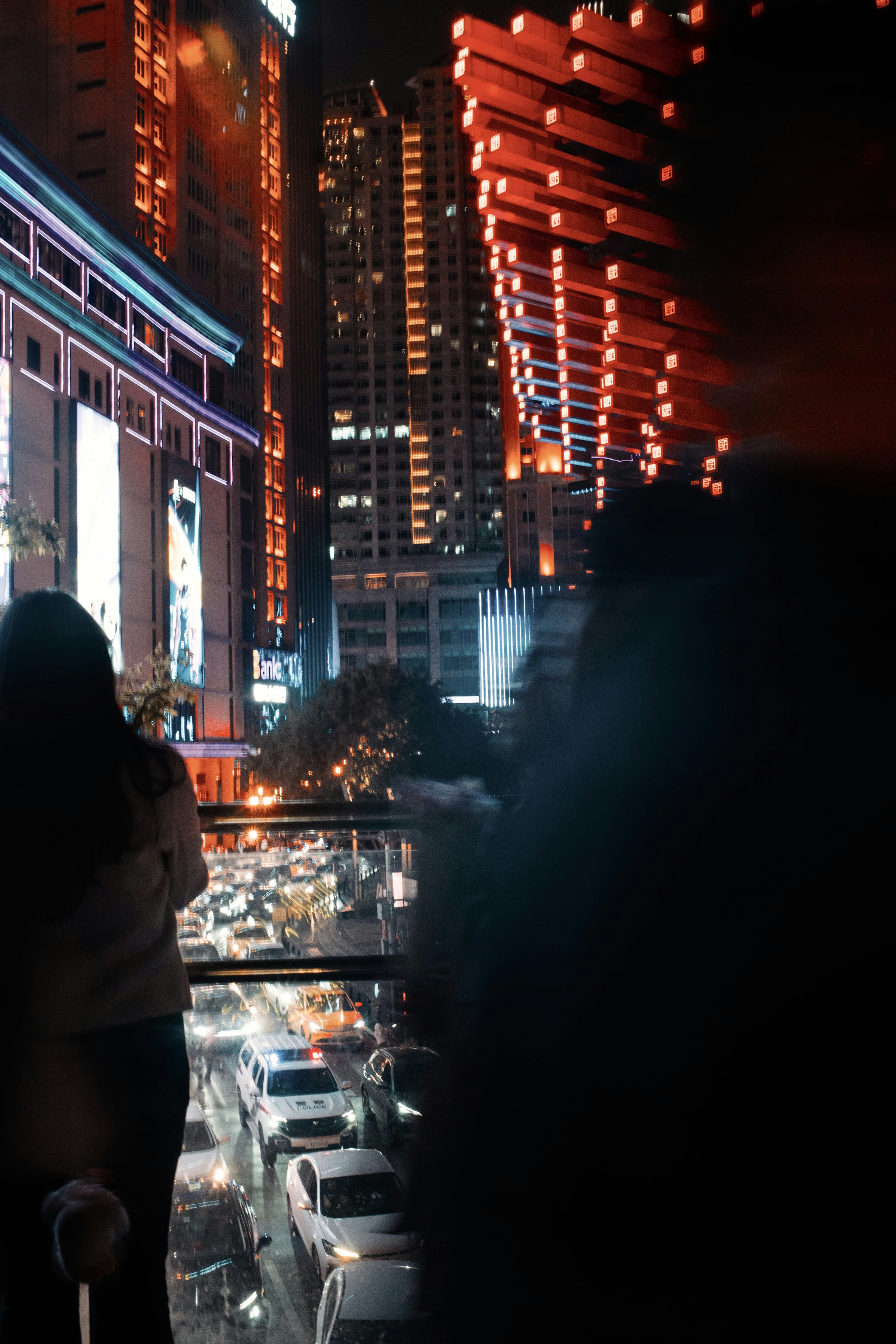 Neon Corridor: City Lights Over a Quiet Balcony