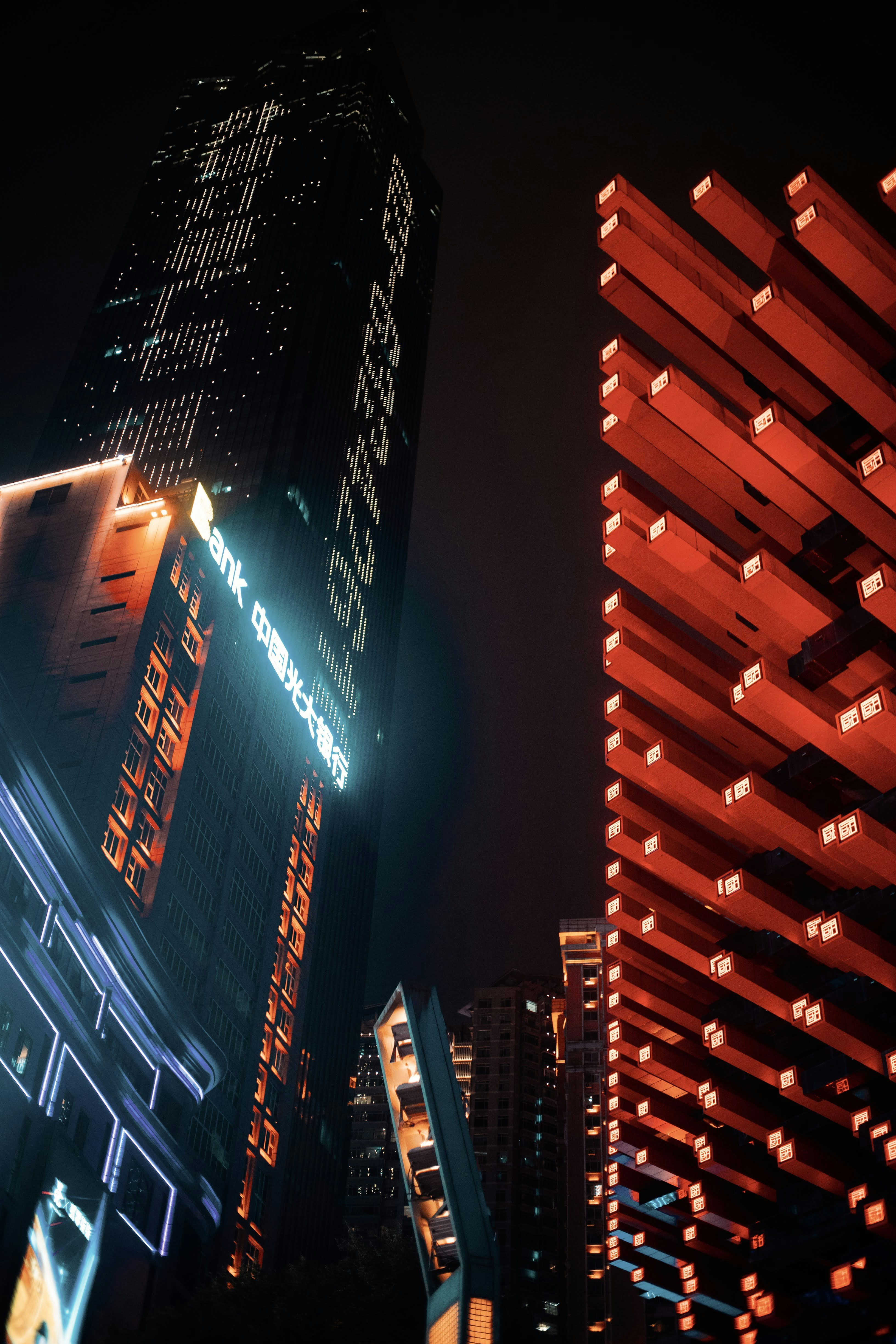 Neon Cadence: Skyscrapers Reaching for the Night