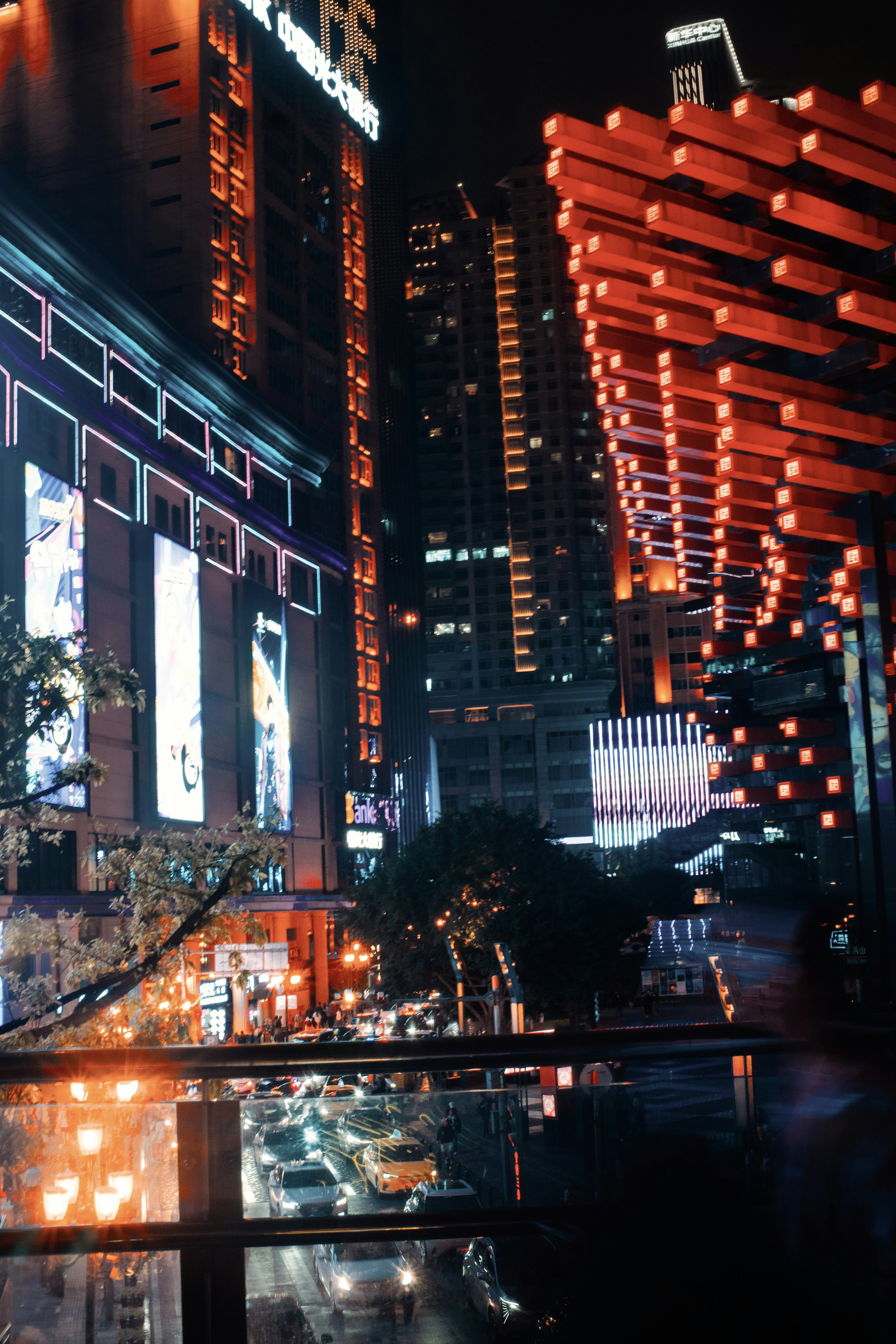 Neon Corridor: Nighttime Cityscape with an Architectural Sculptural Landmark
