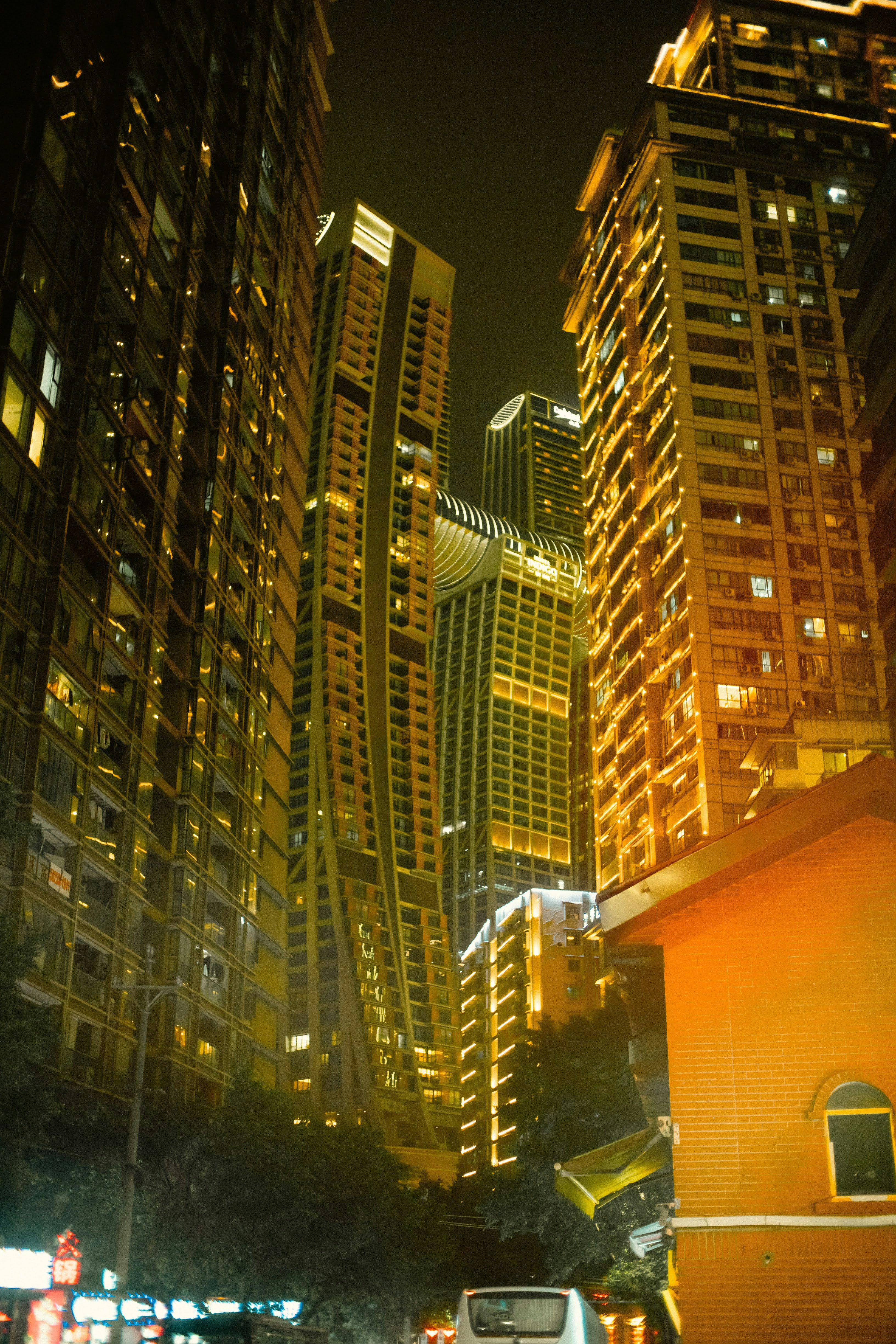 Neon Canopy: Nighttime Skyscraper Confluence