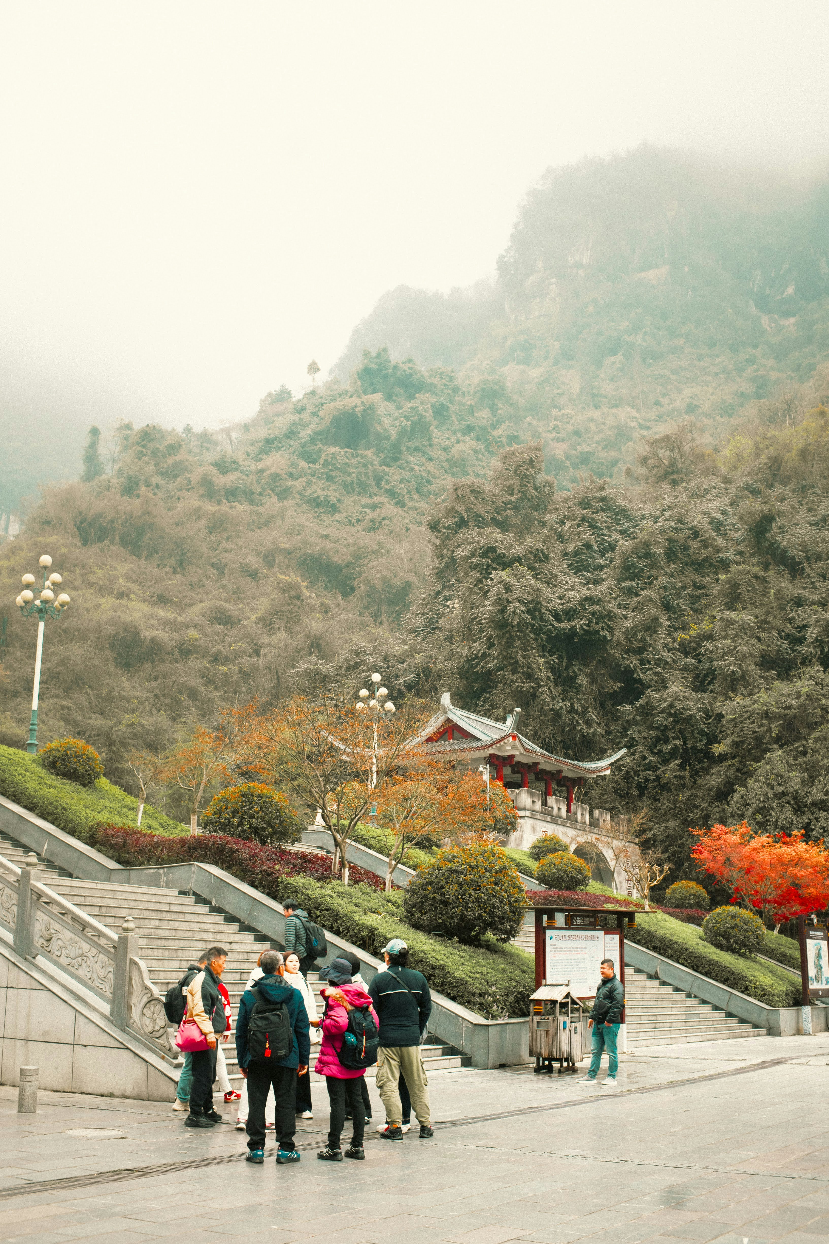Hushed Temple Reach: People Gather at the Mountain Shrine Plaza