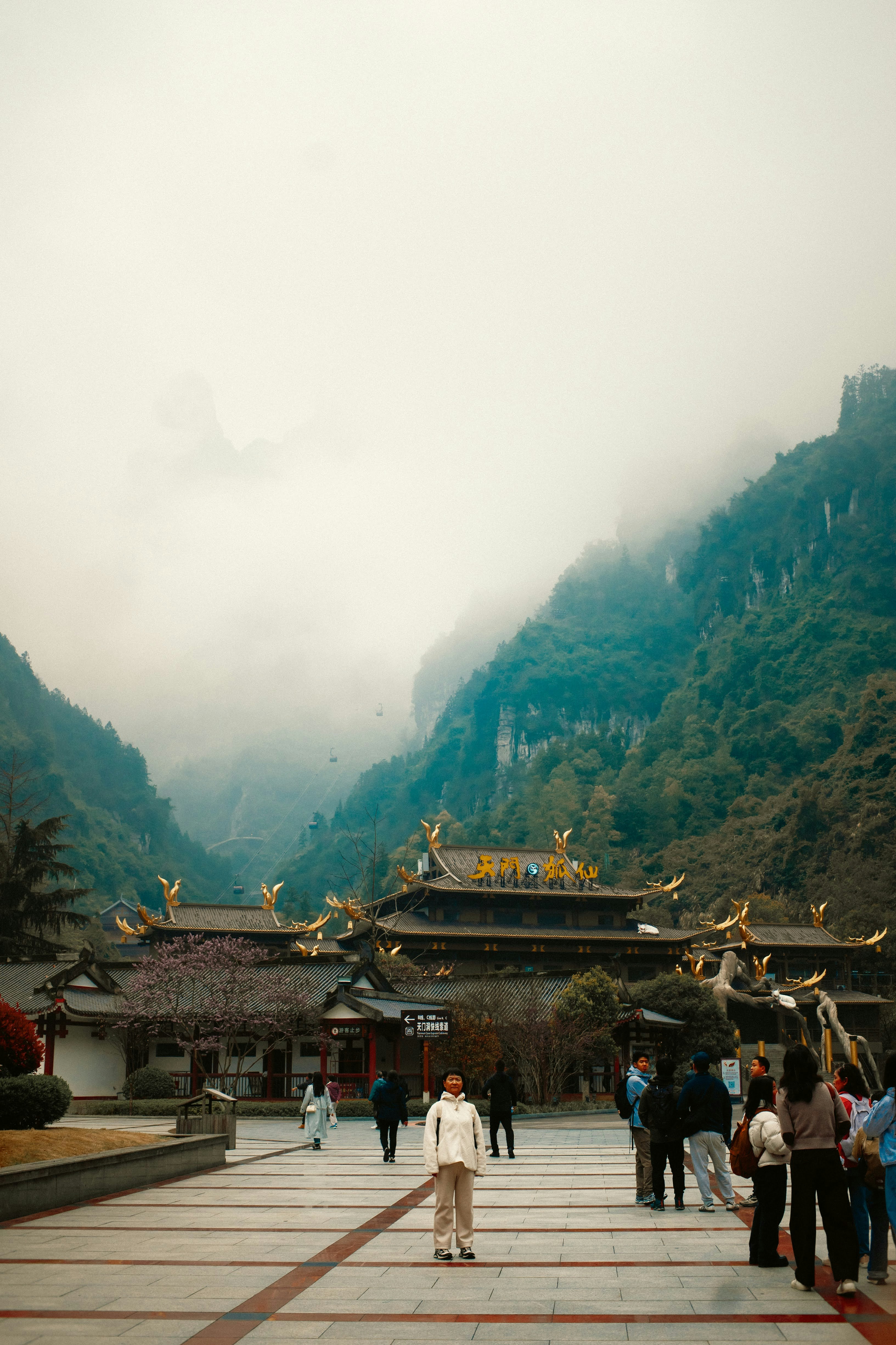Sacred Courtyard Beneath Mist-Kissed Peaks