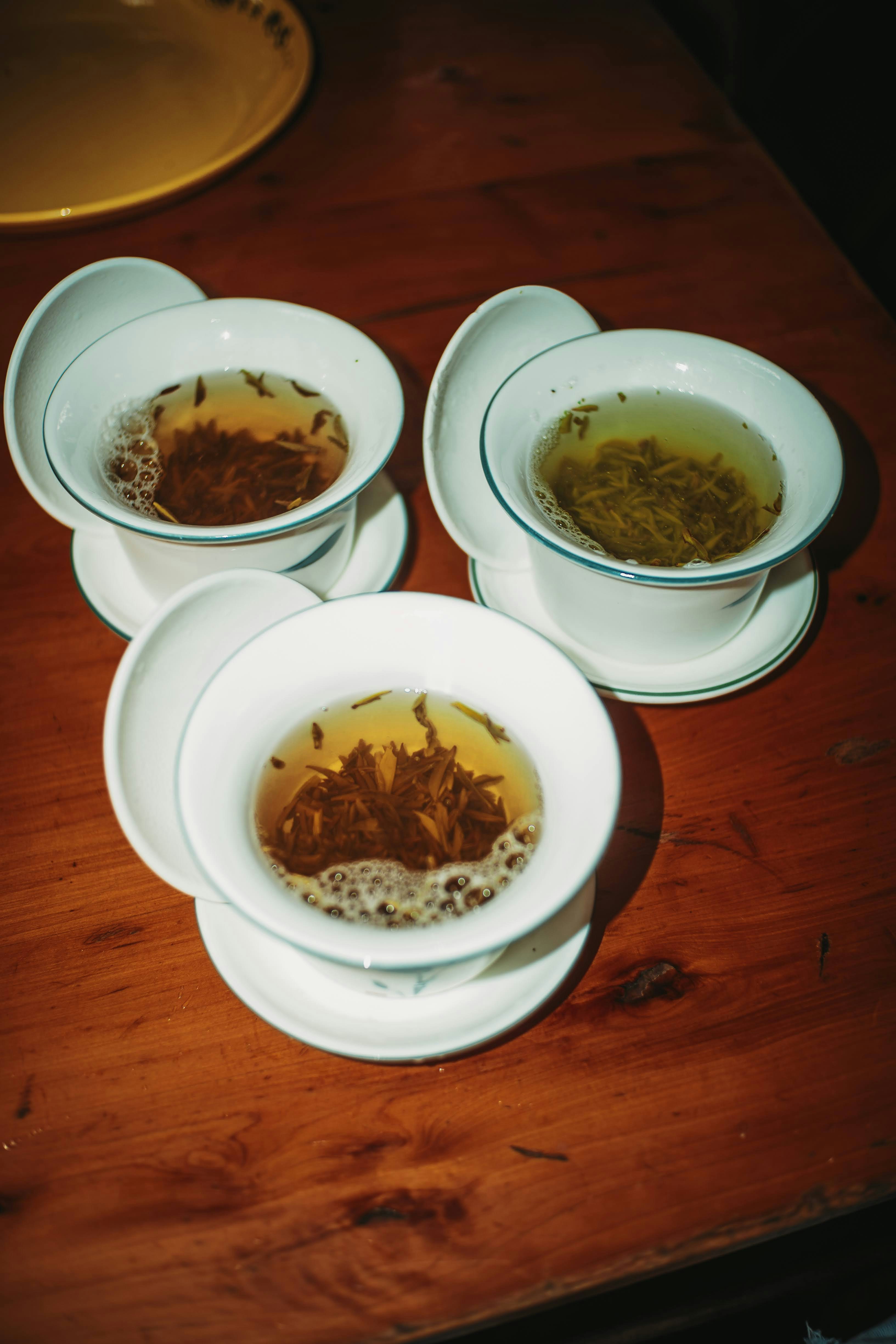 Triplet of Tea: Ceremonial Cups on a Rustic Table