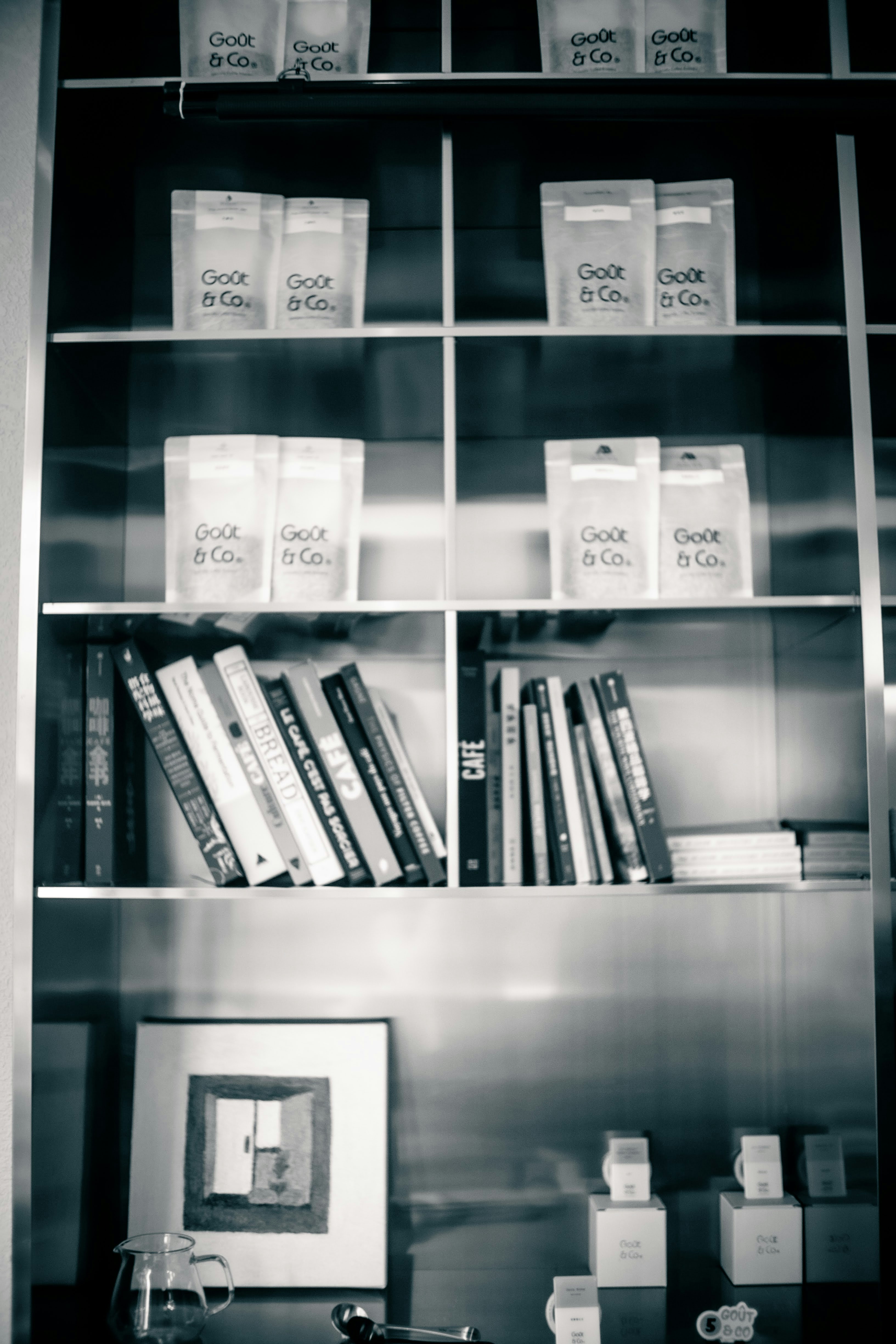 Shelf of Quiet Knowledge: Books and Packages in a Monochrome Display