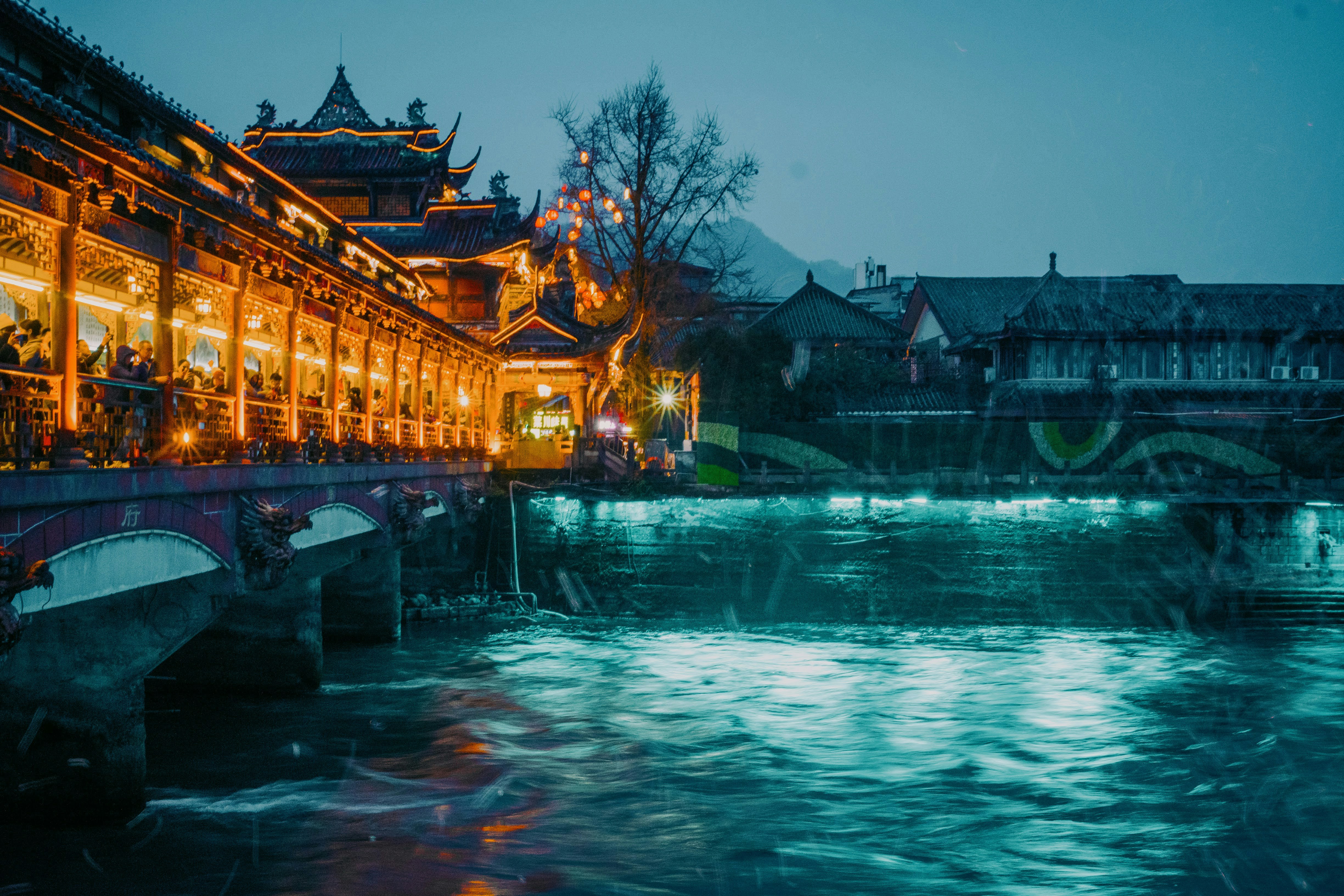 Golden Lights Over the Winter River Bridge