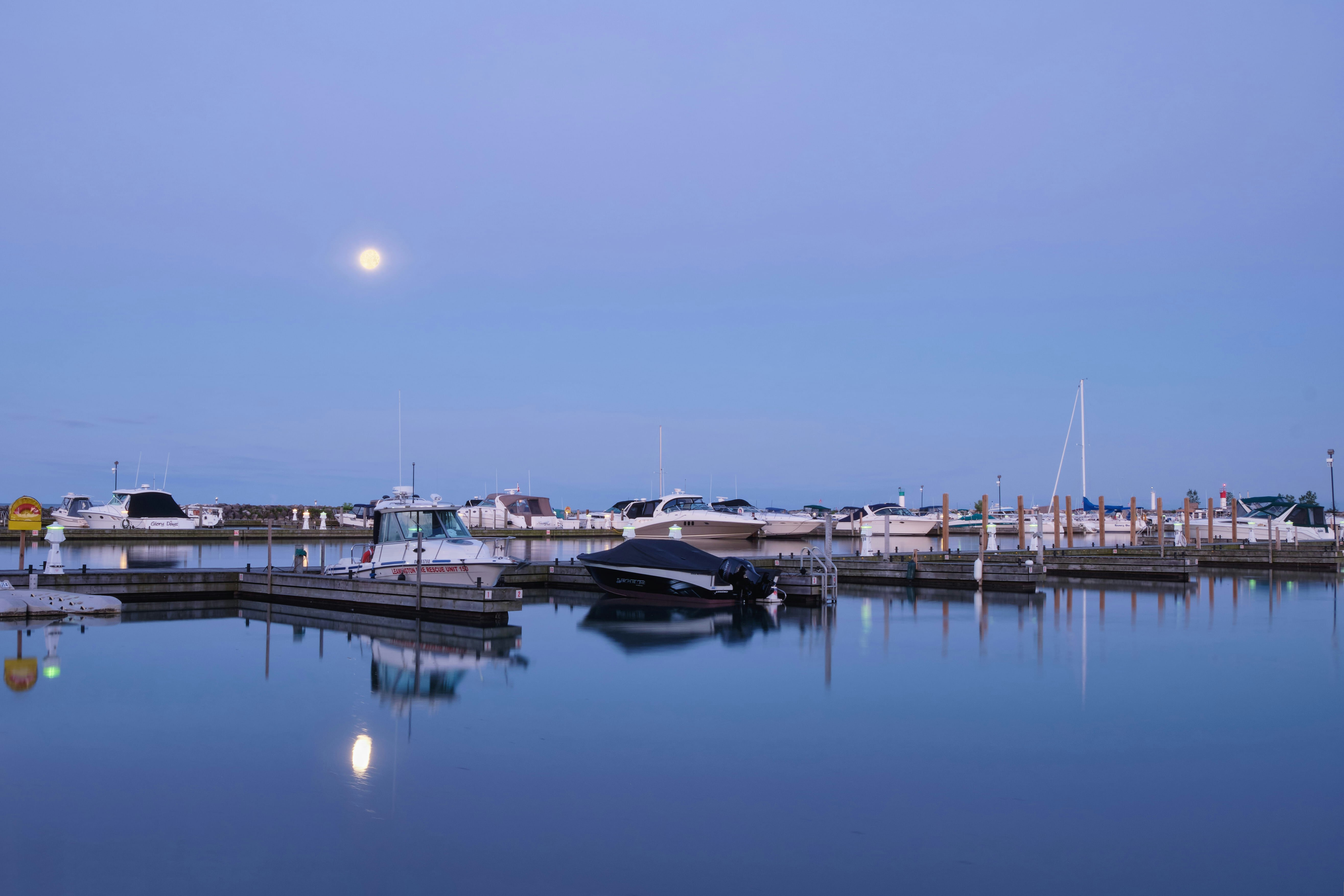 Moonlit Marina: Boats Rest at Dusk