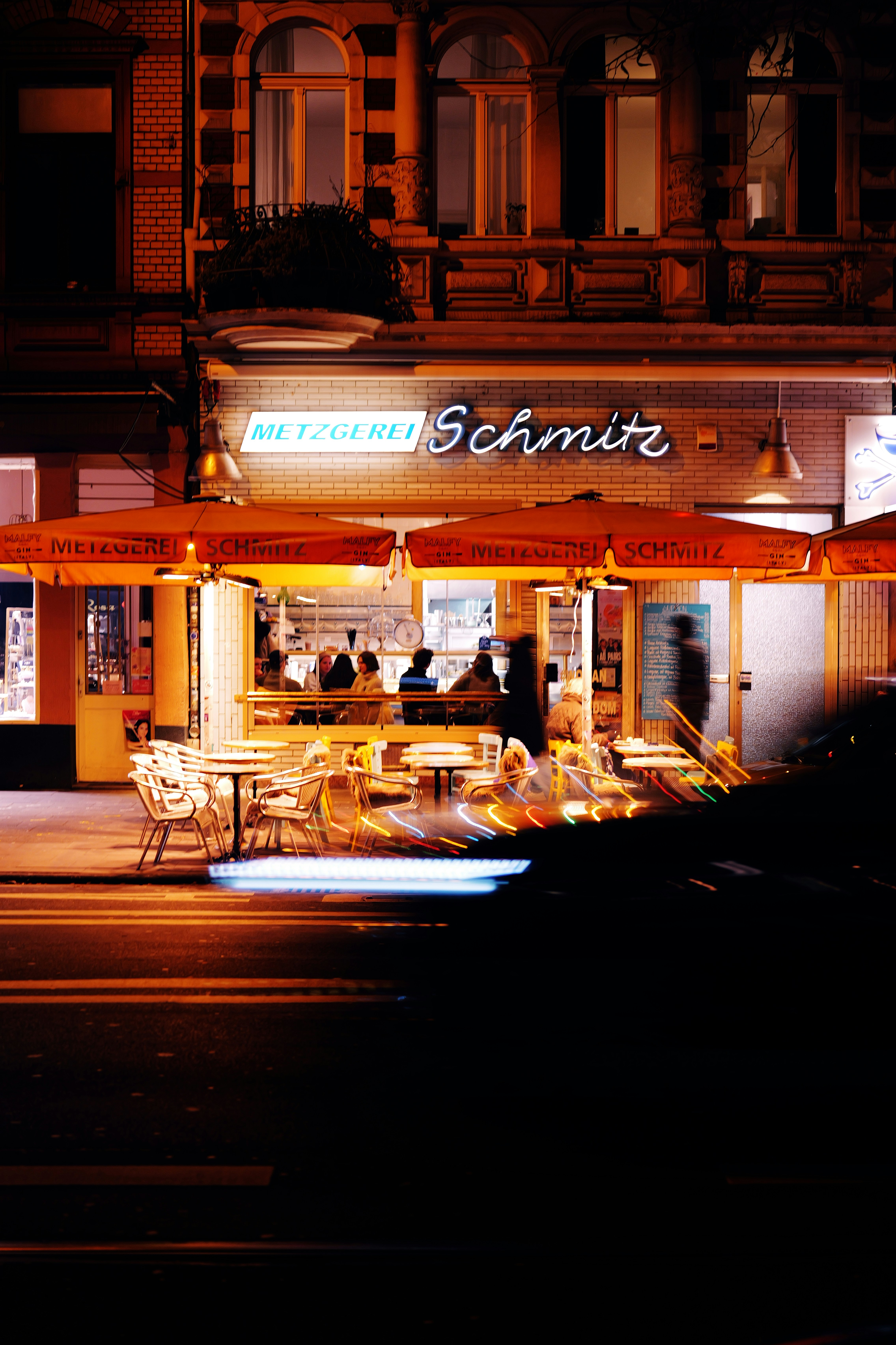 Neon Bistro at Dusk: A Berlinized Facade of Light and Motion