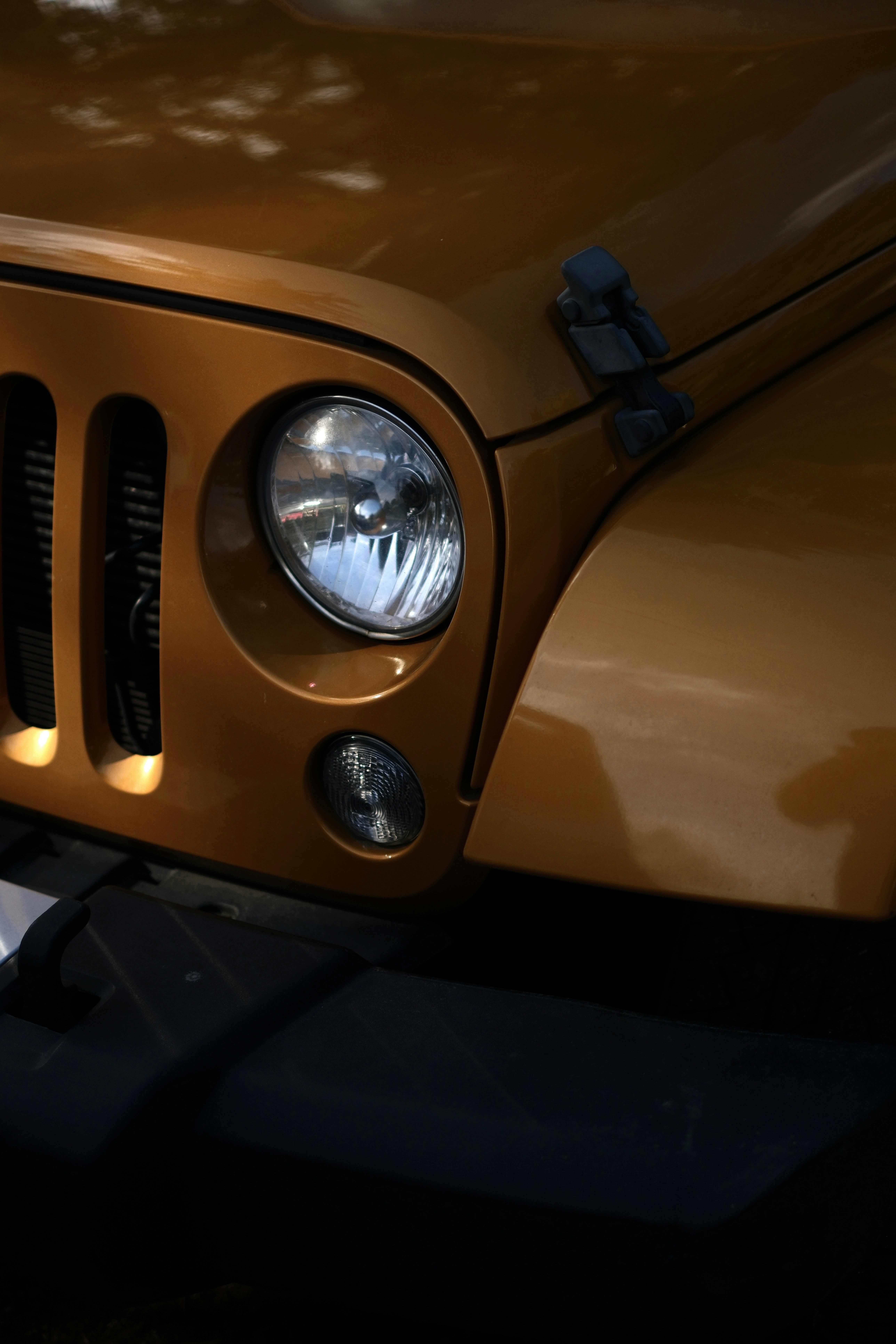 Golden Grille: The Front Corner of a Desert-Hand Jeep