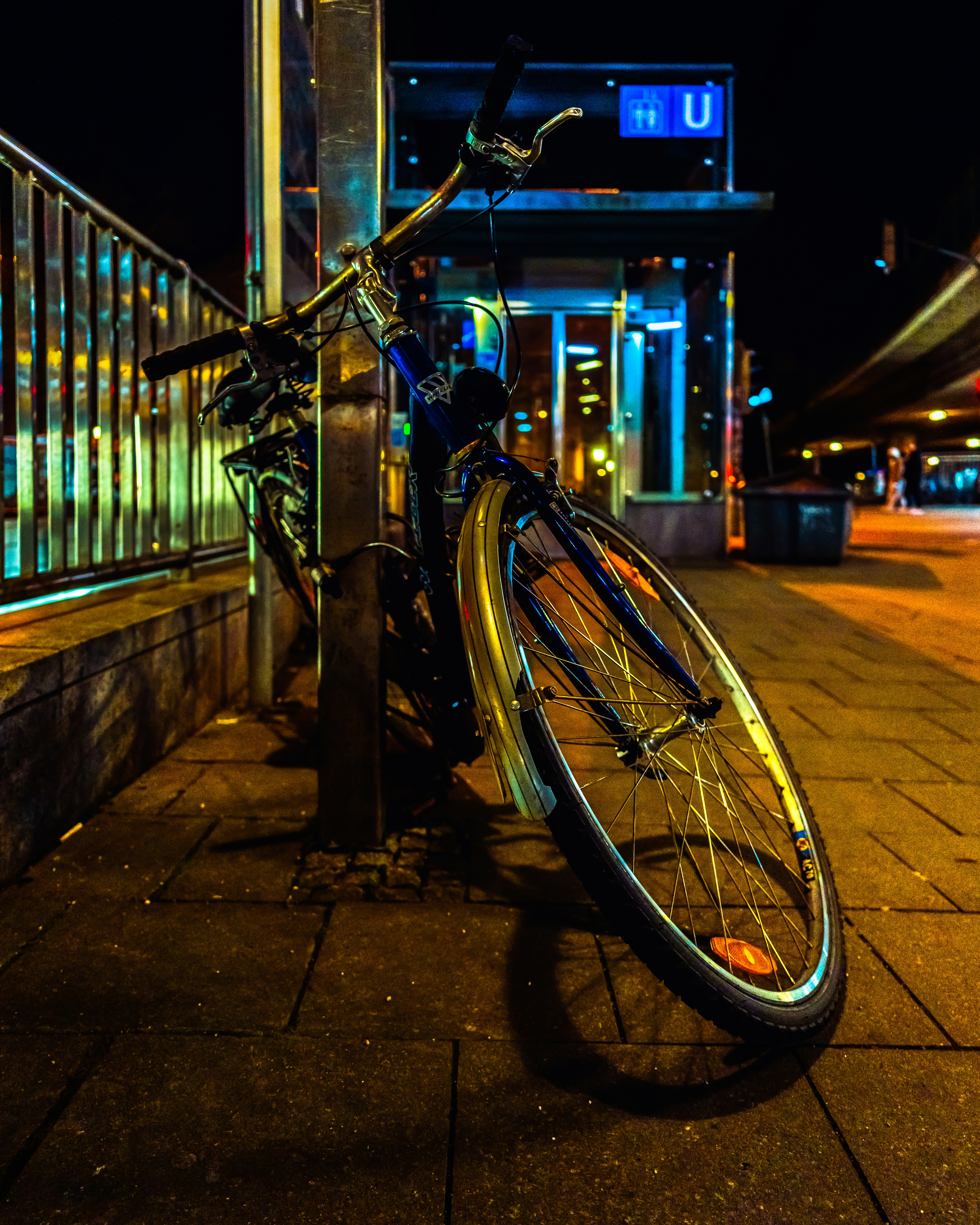 Cycle at Night: A Bent Bicycle Leaning Against the Rail