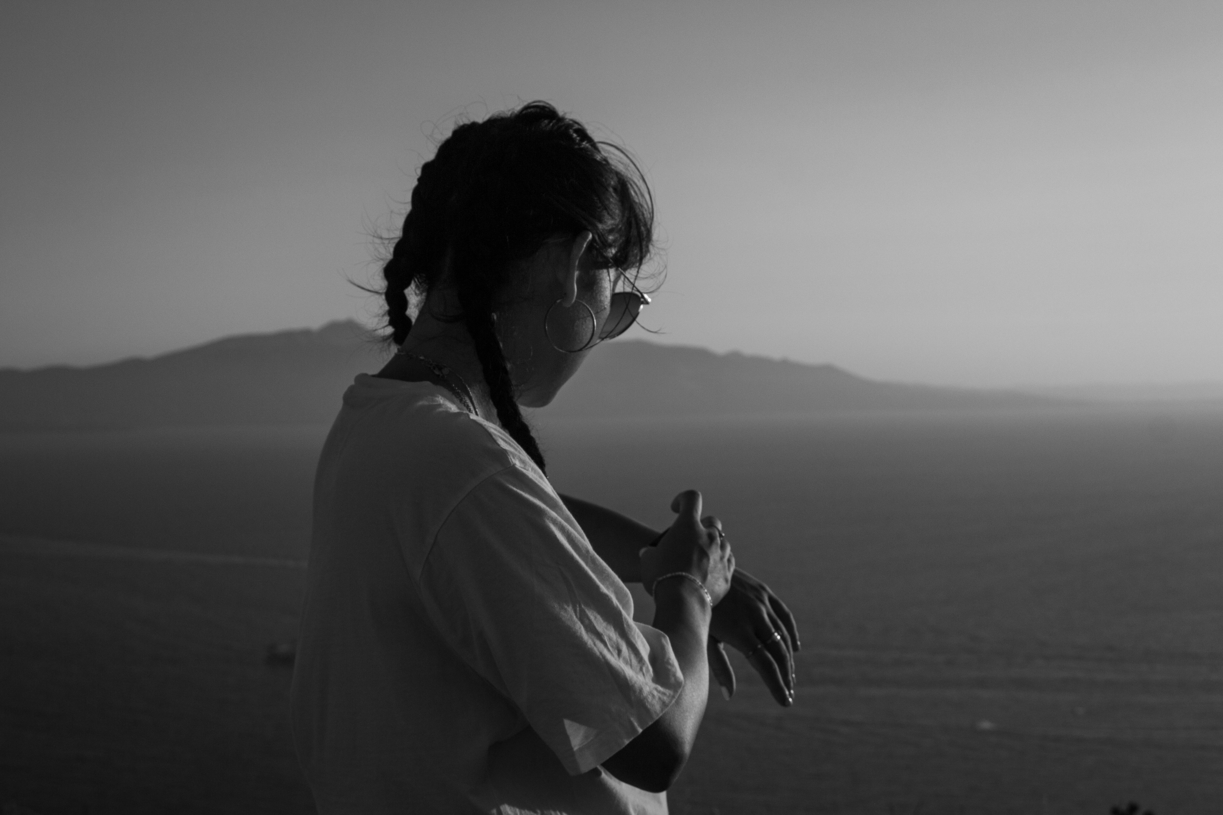 Silhouette of a Traveler with a Backpacked Moment by the Sea