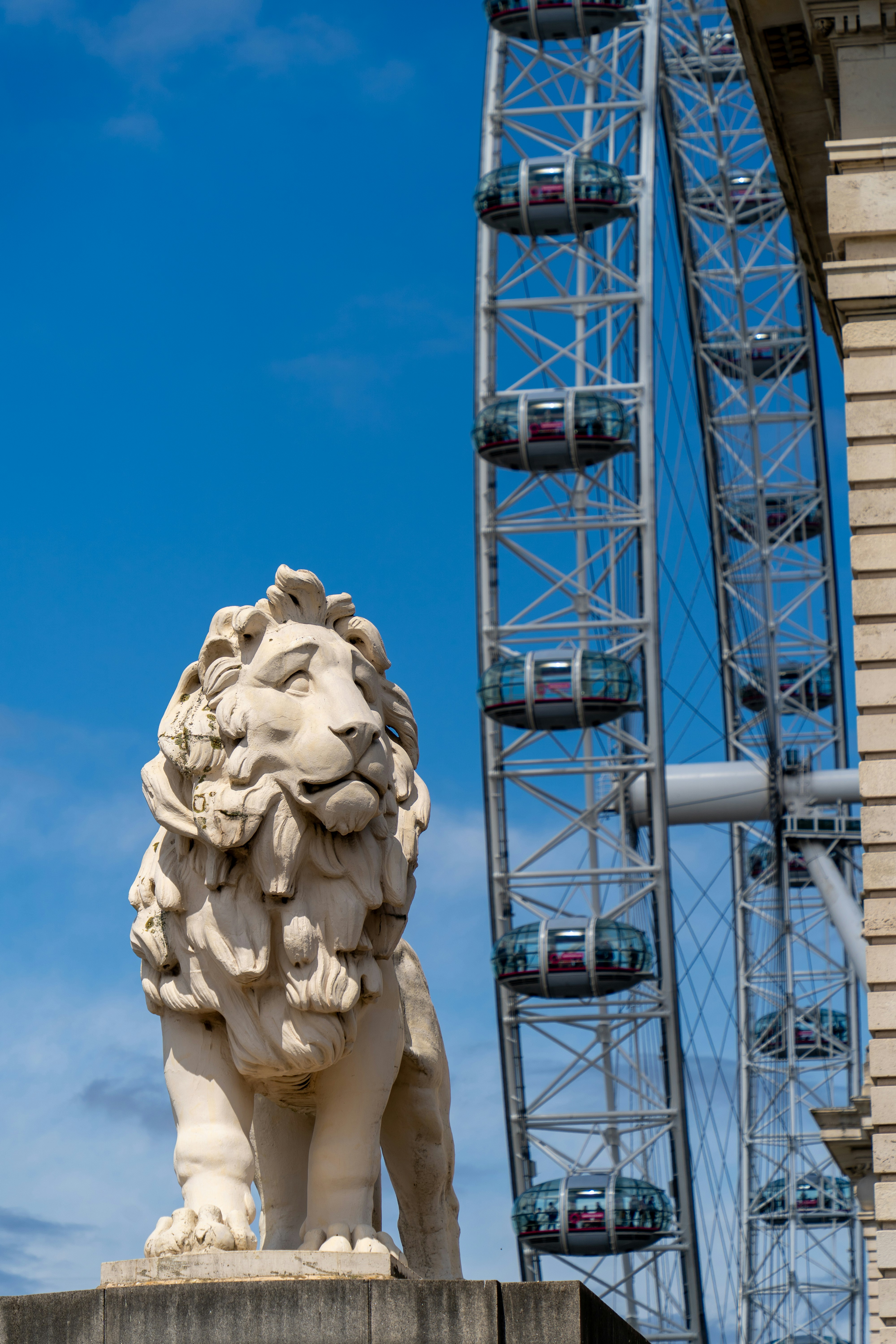 Stone Guardian and the Giant Wheel: A Portrait by the Thames