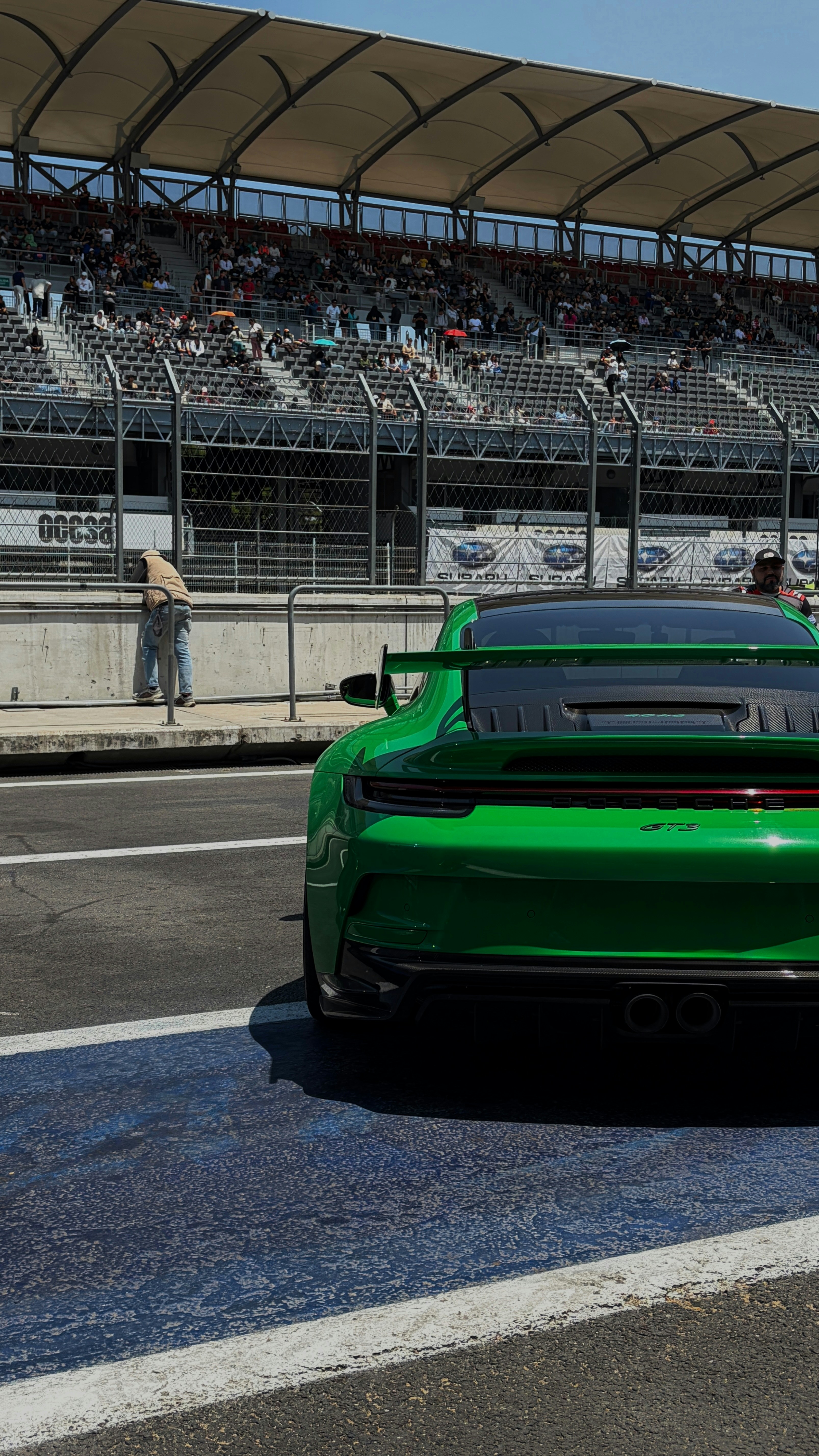 Green Thunder on the Pit Lane: A Race Day Car in Full View