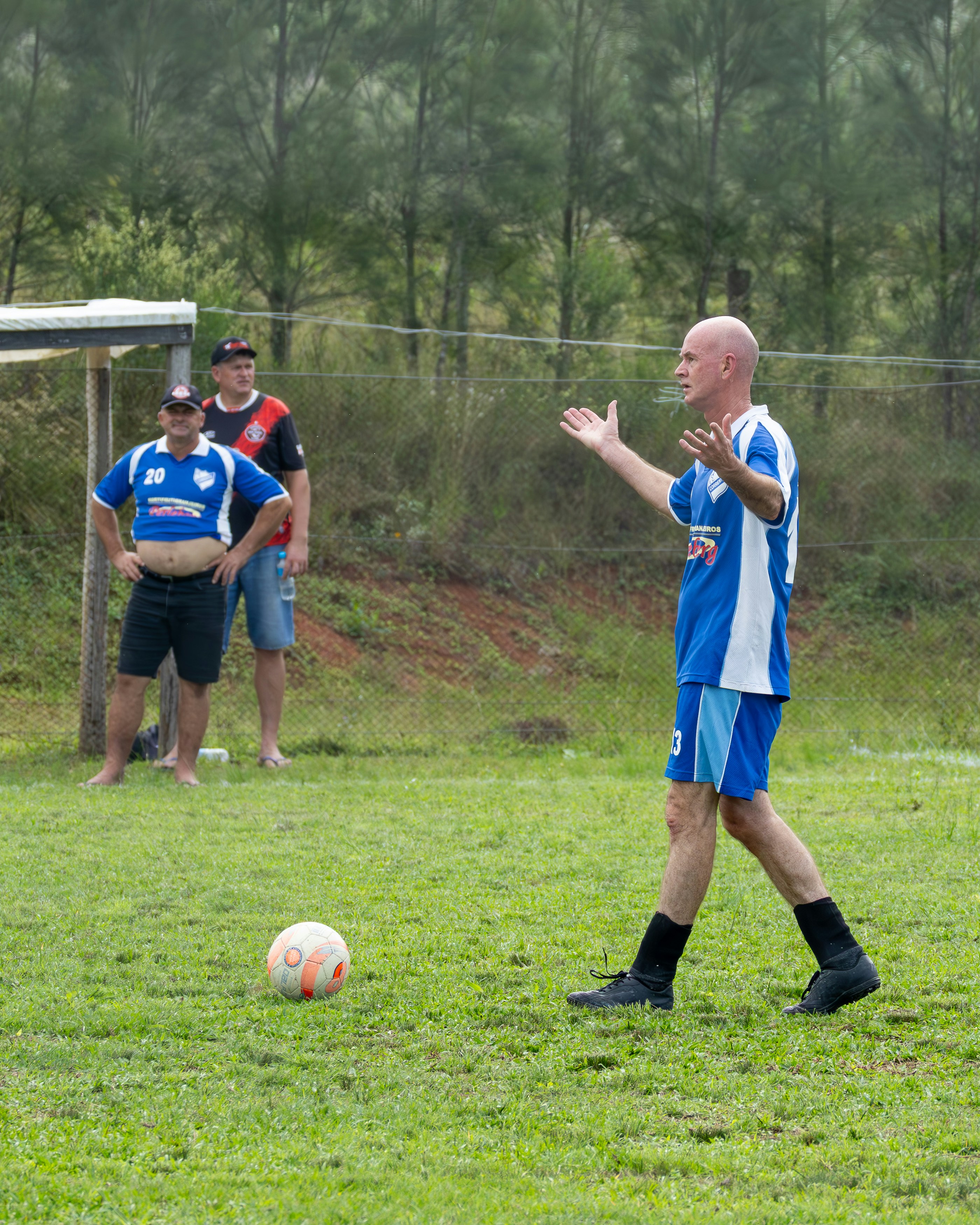Coach on the Field: A Game Moment Around the Ball
