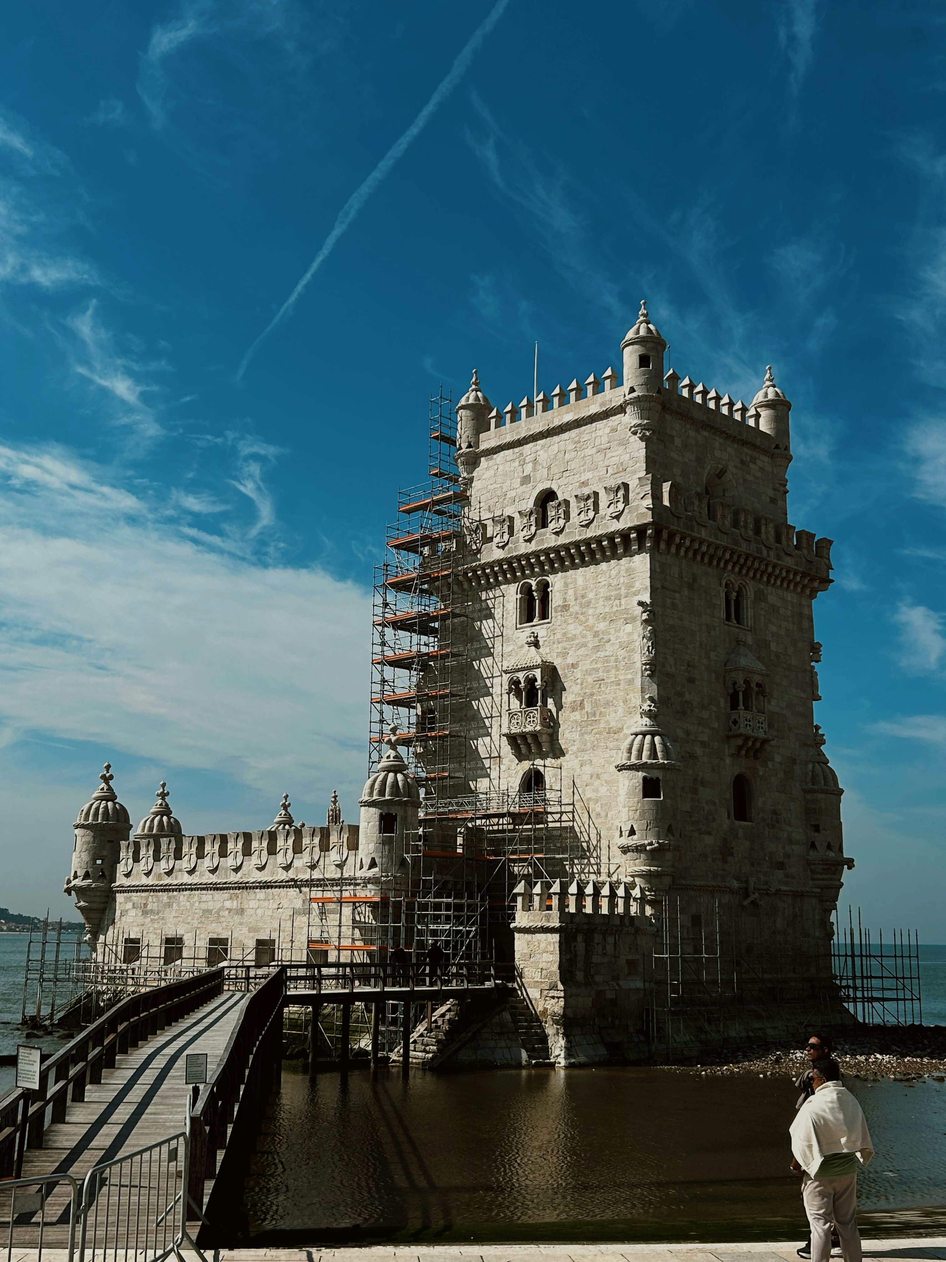 Castle on the Sea: A Towering Fortress Under Blue Skies