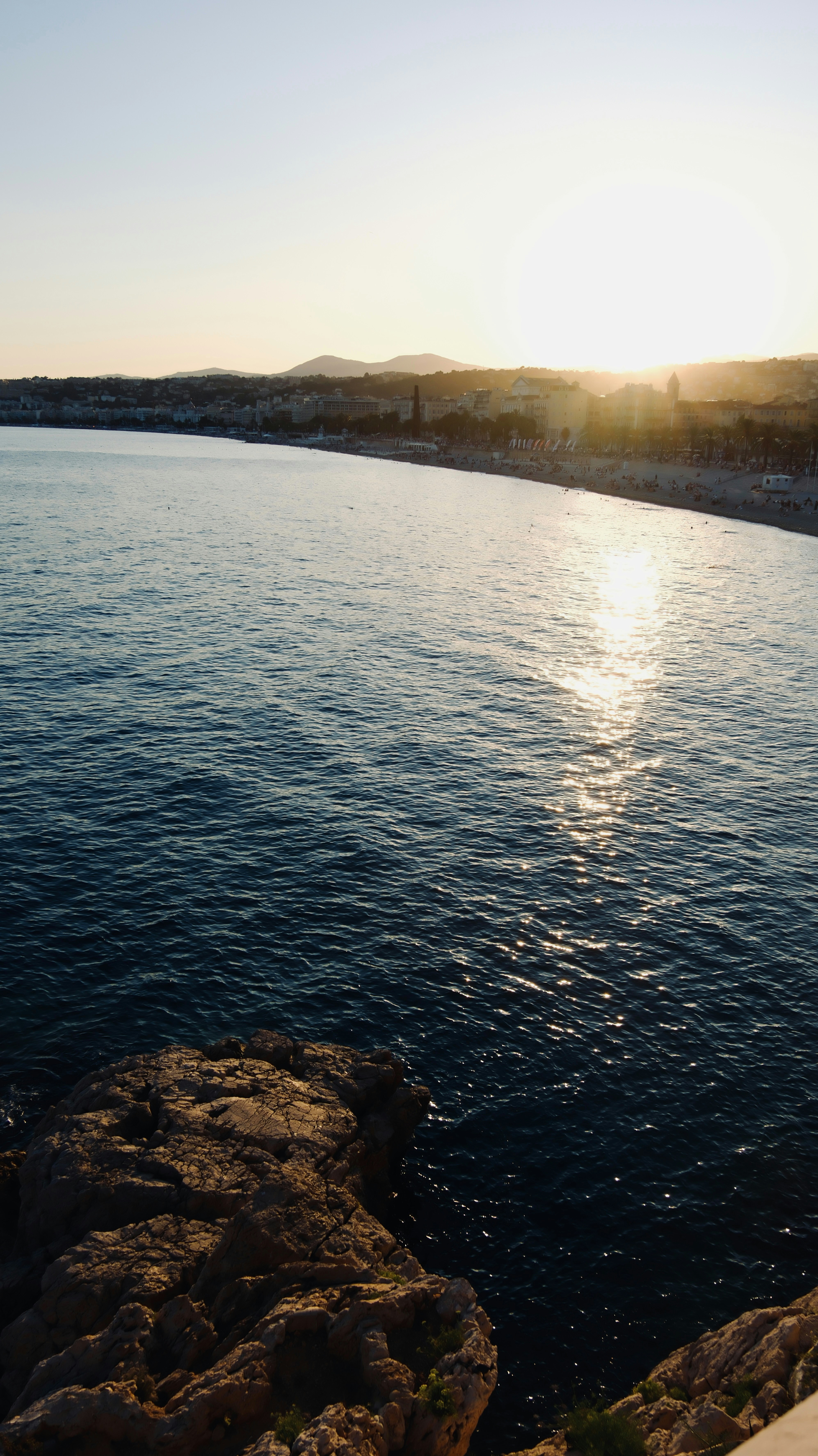Sunlit Crest: Coastal Horizon at Golden Hour