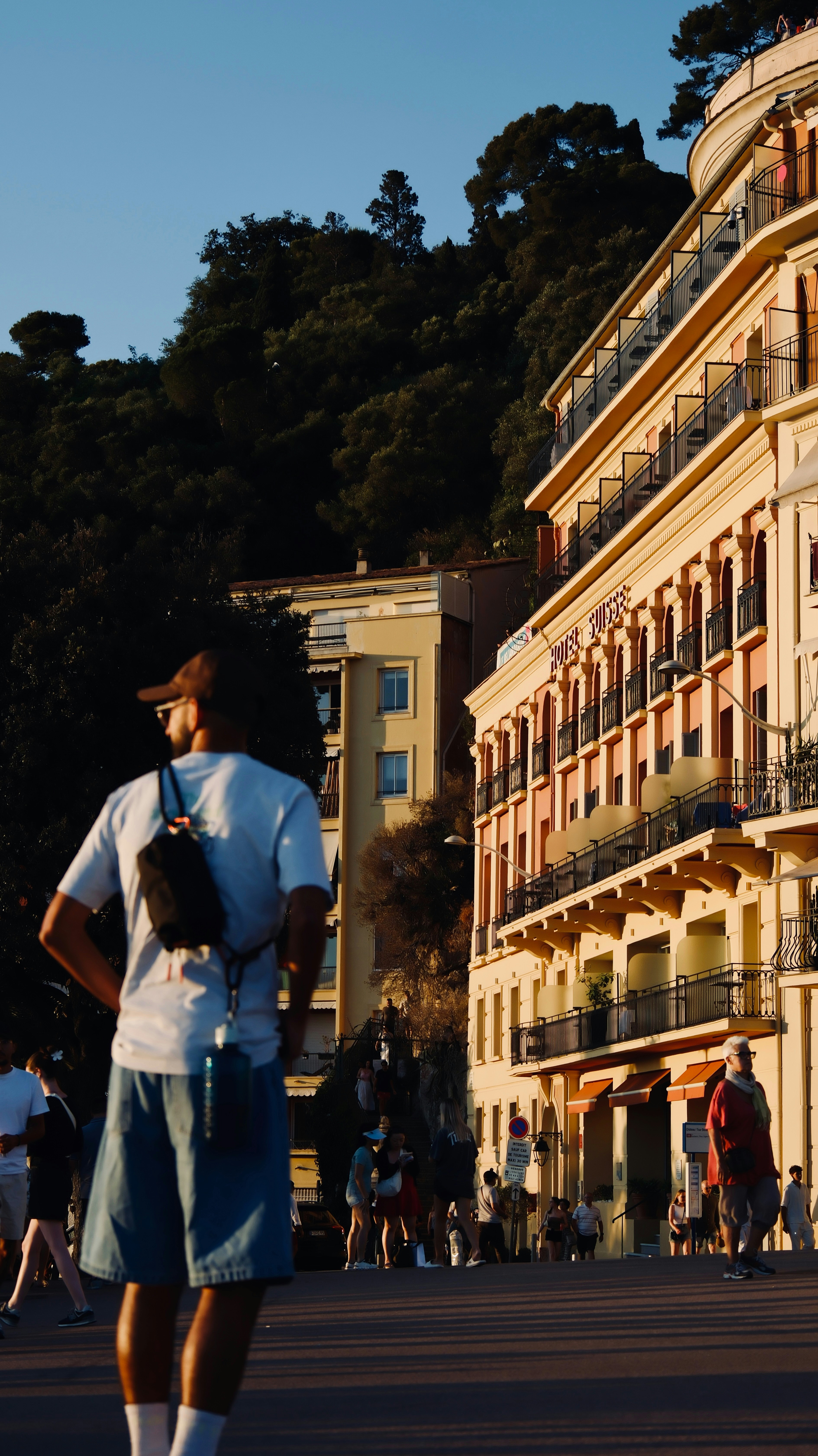 Sunlit Promenade with Colorful Hotel Facade