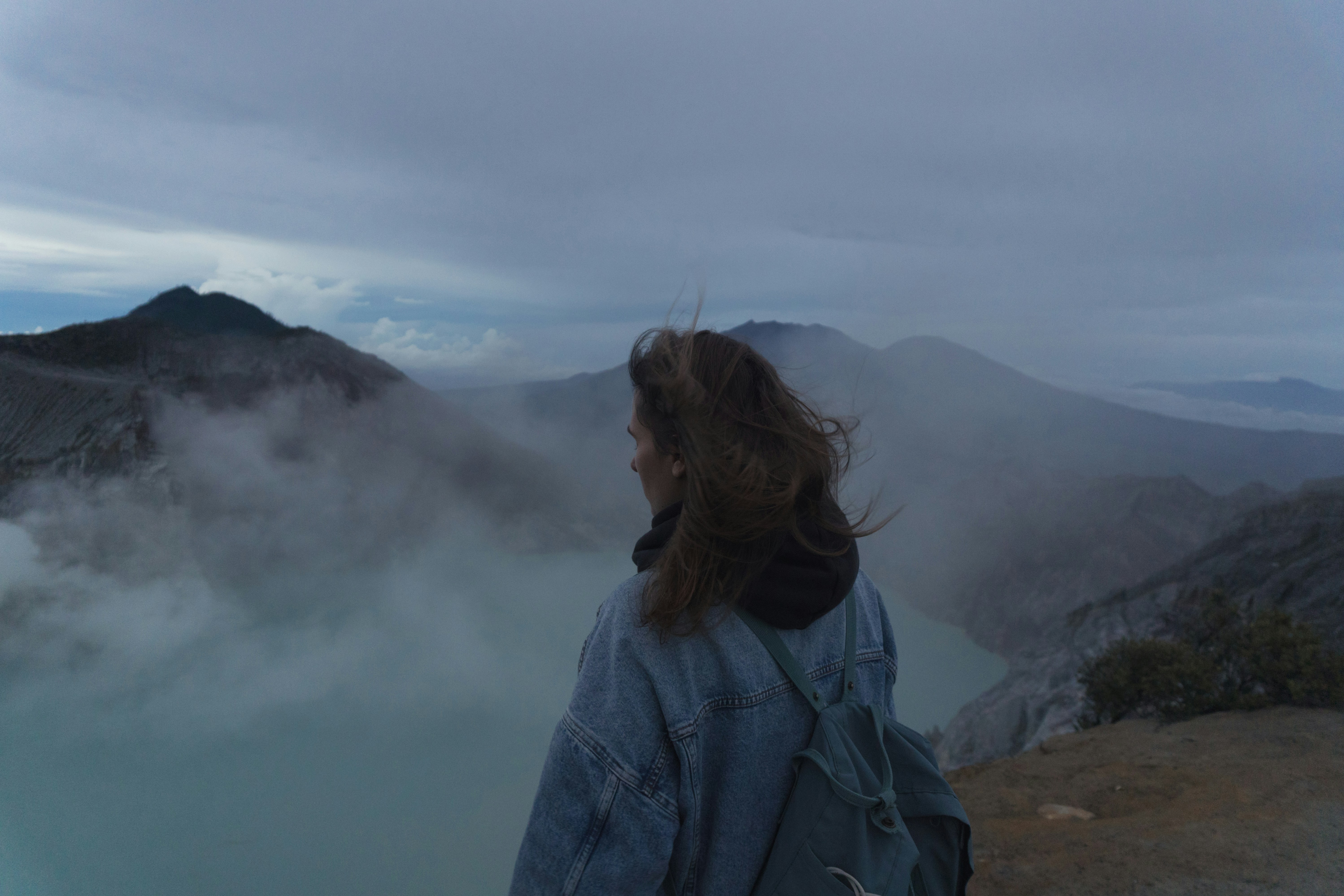 Where the Clouds Meet the Edge: A Lone Explorer at the Rim