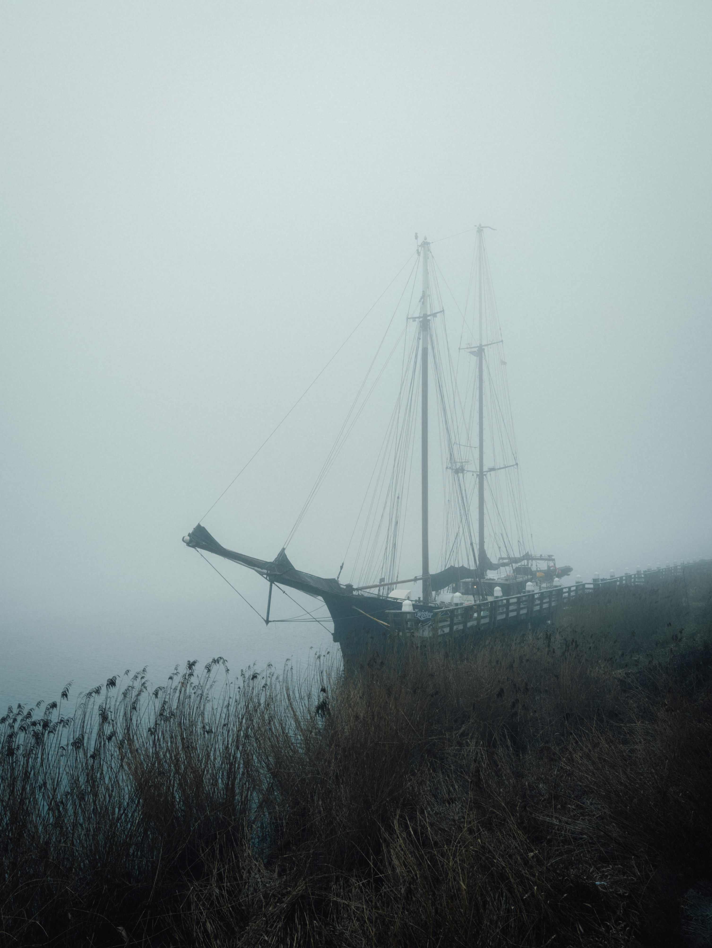Mist-worn Vessel: A Silent Dock in Fog
