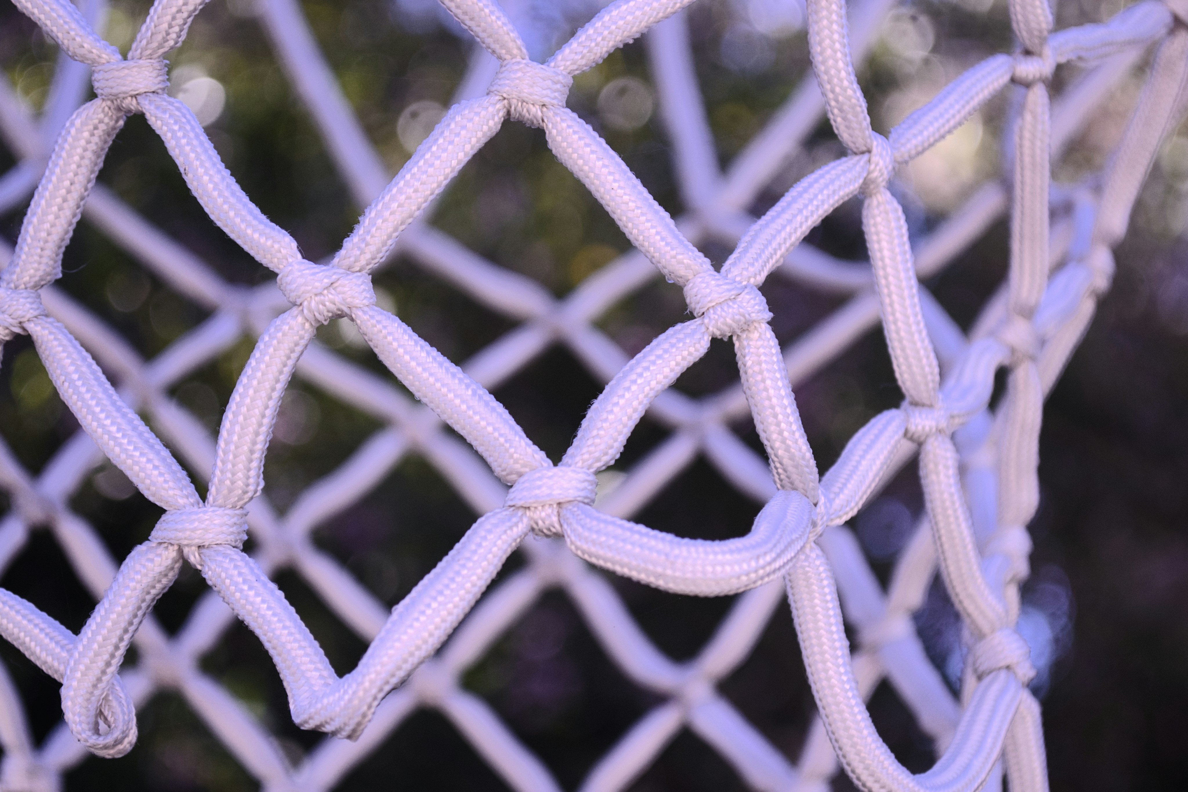 Interwoven Mesh: Close-Up of Knotted White Rope Net