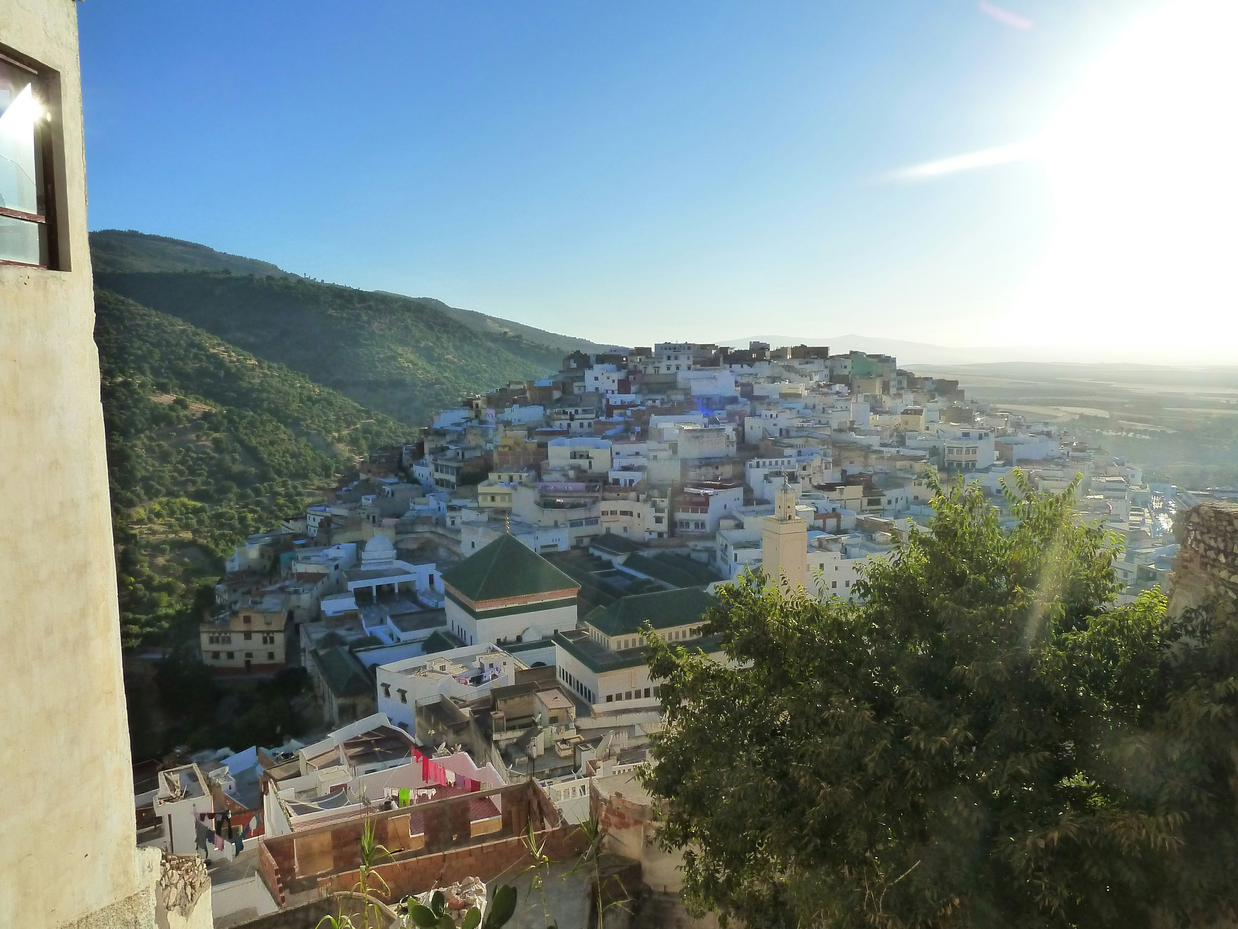 Hilltop Village: A Sunlit Cascade of White Facades