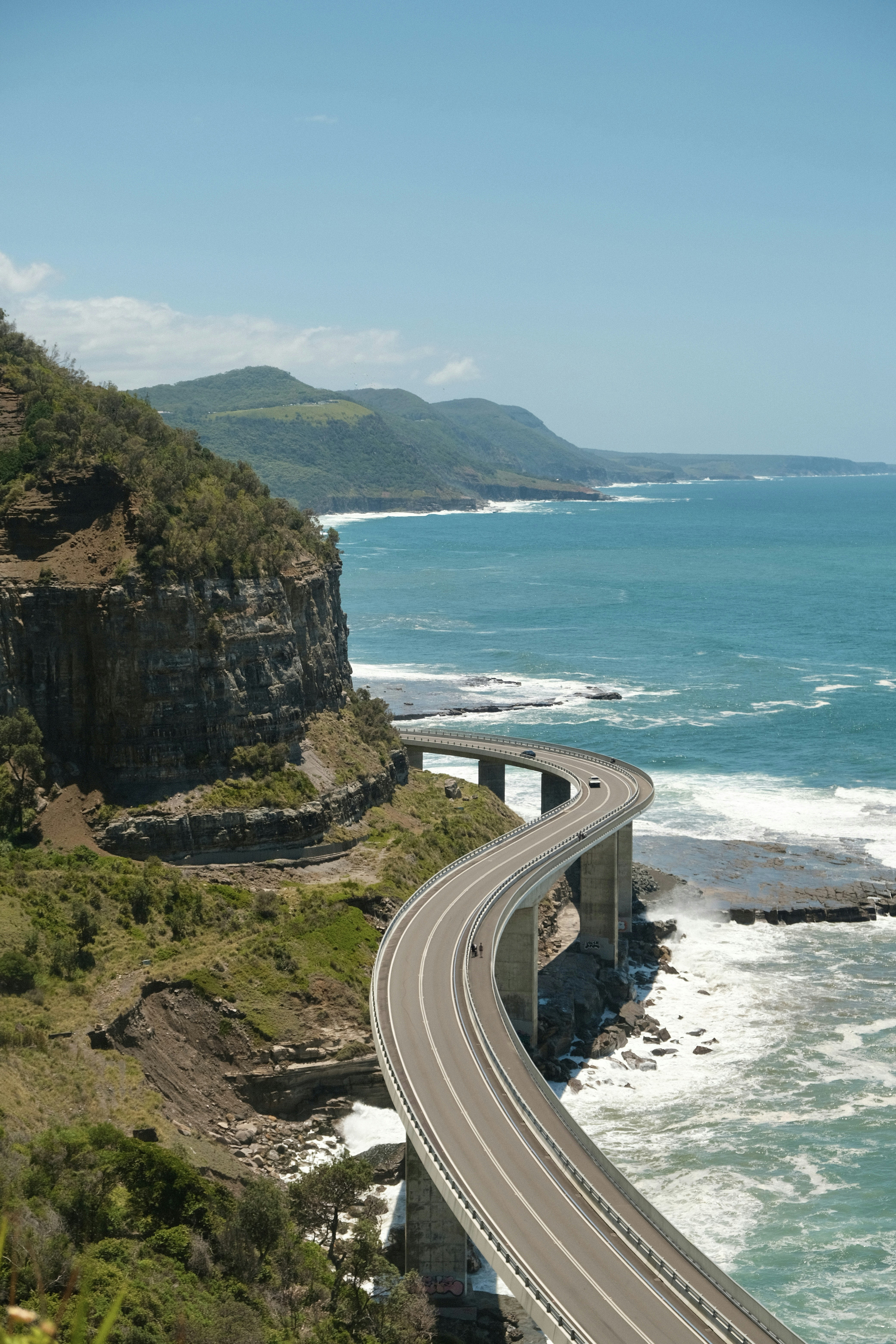 Coastal Viaduct Coil: A Ribbon Bridge Against Turquoise Seas