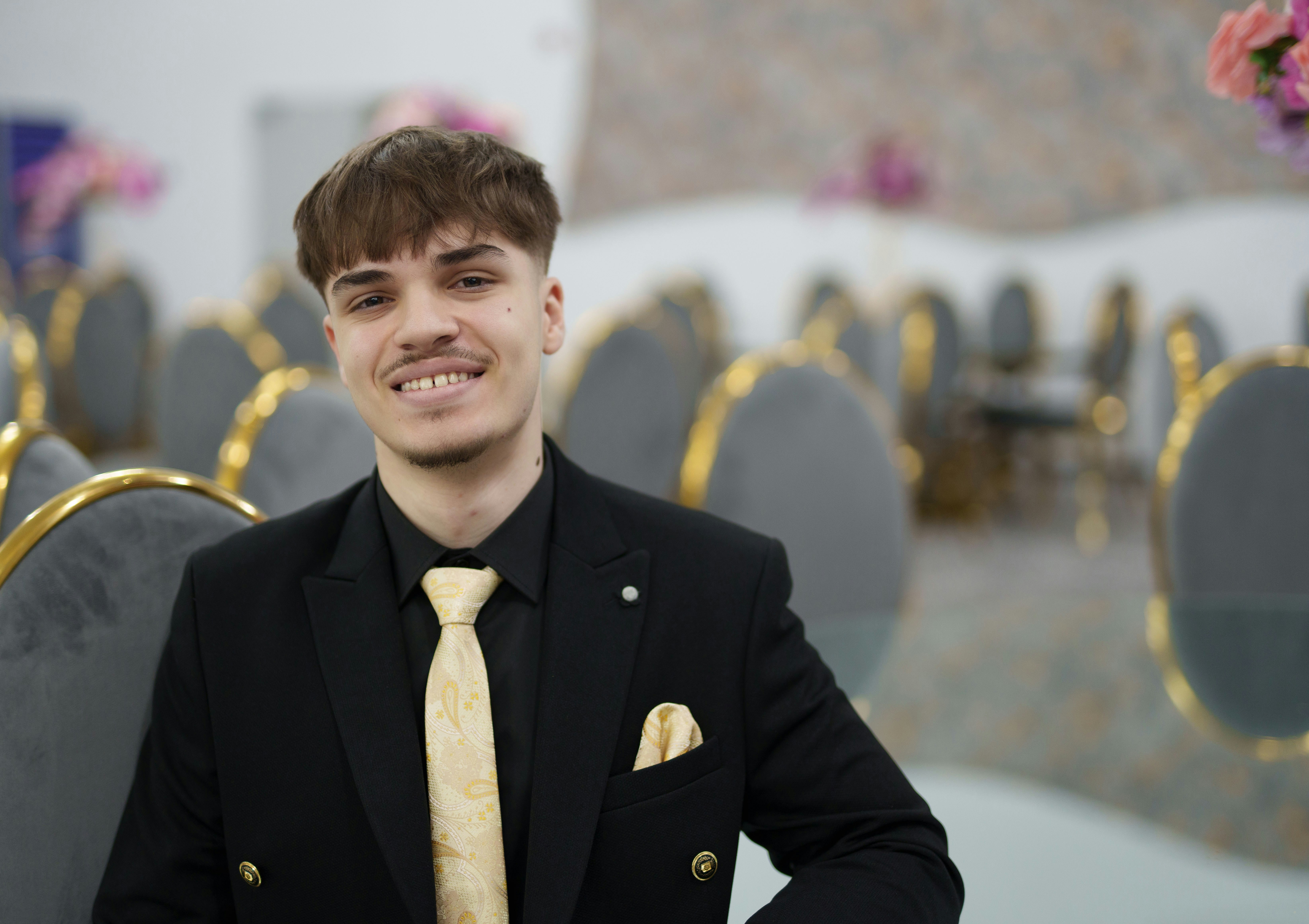 Portrait in a Formal Hall: A Smiling Moment in a Velvet-Backed Setting