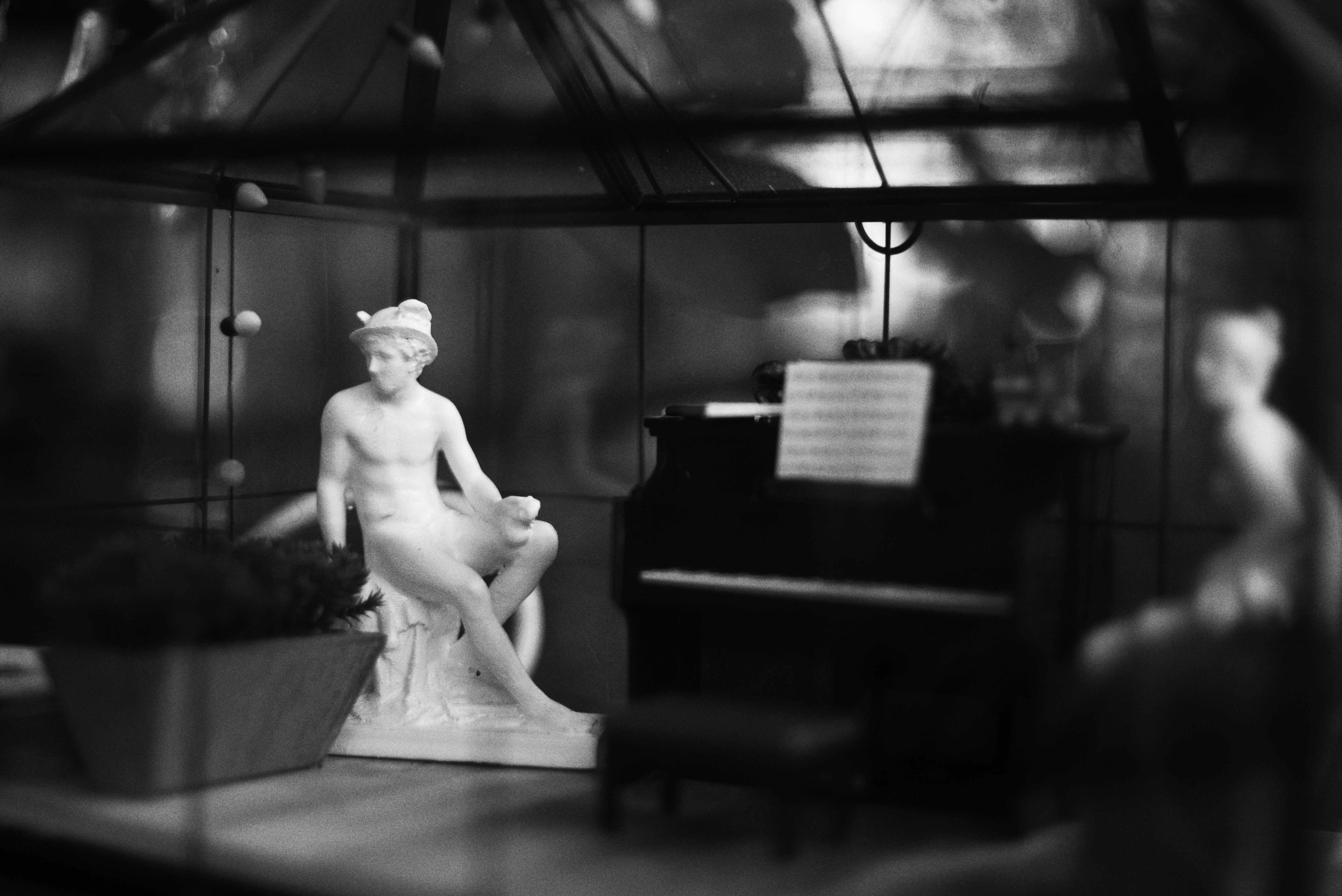 Silhouette of Classical Figurines in a Piano Nook