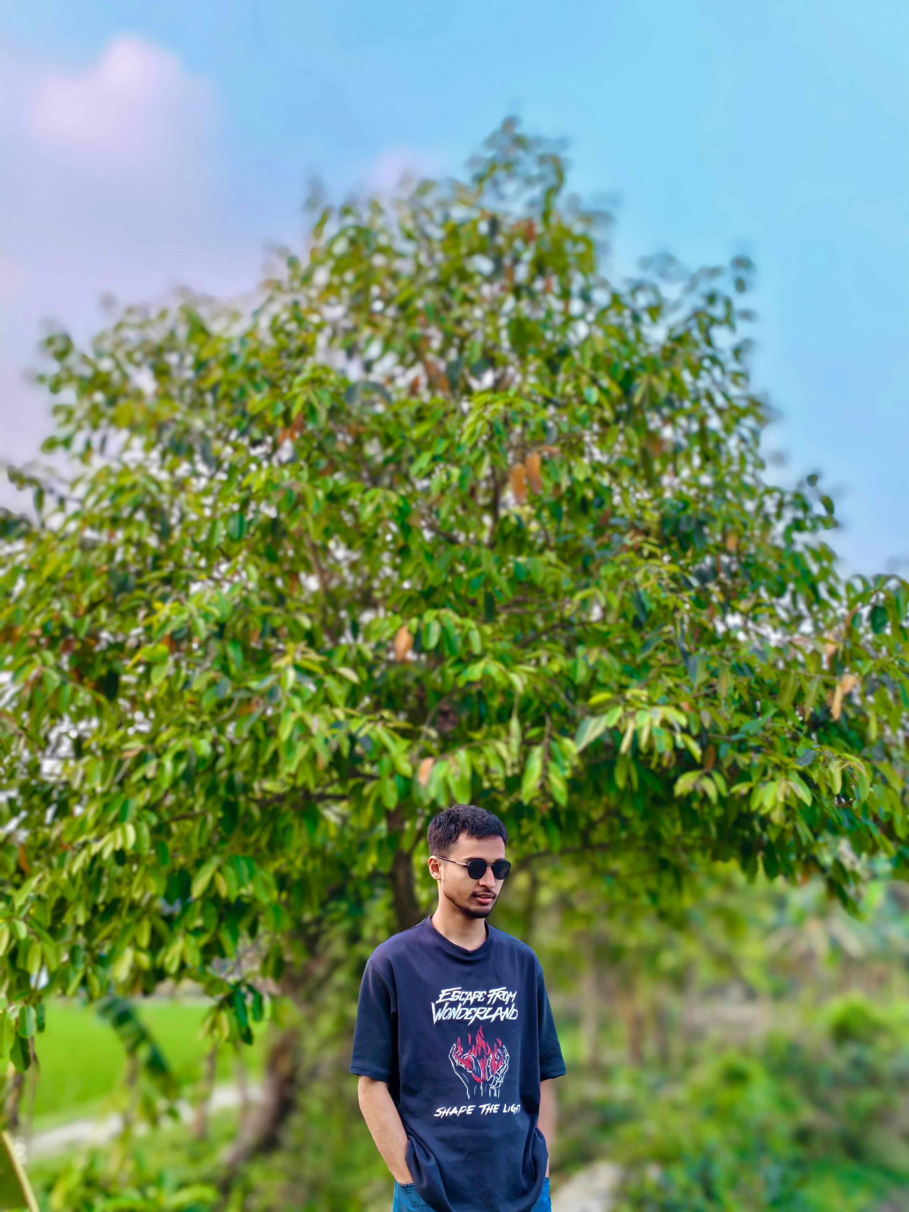 Portrait under a Canopy: A Casual Moment in the Orchard