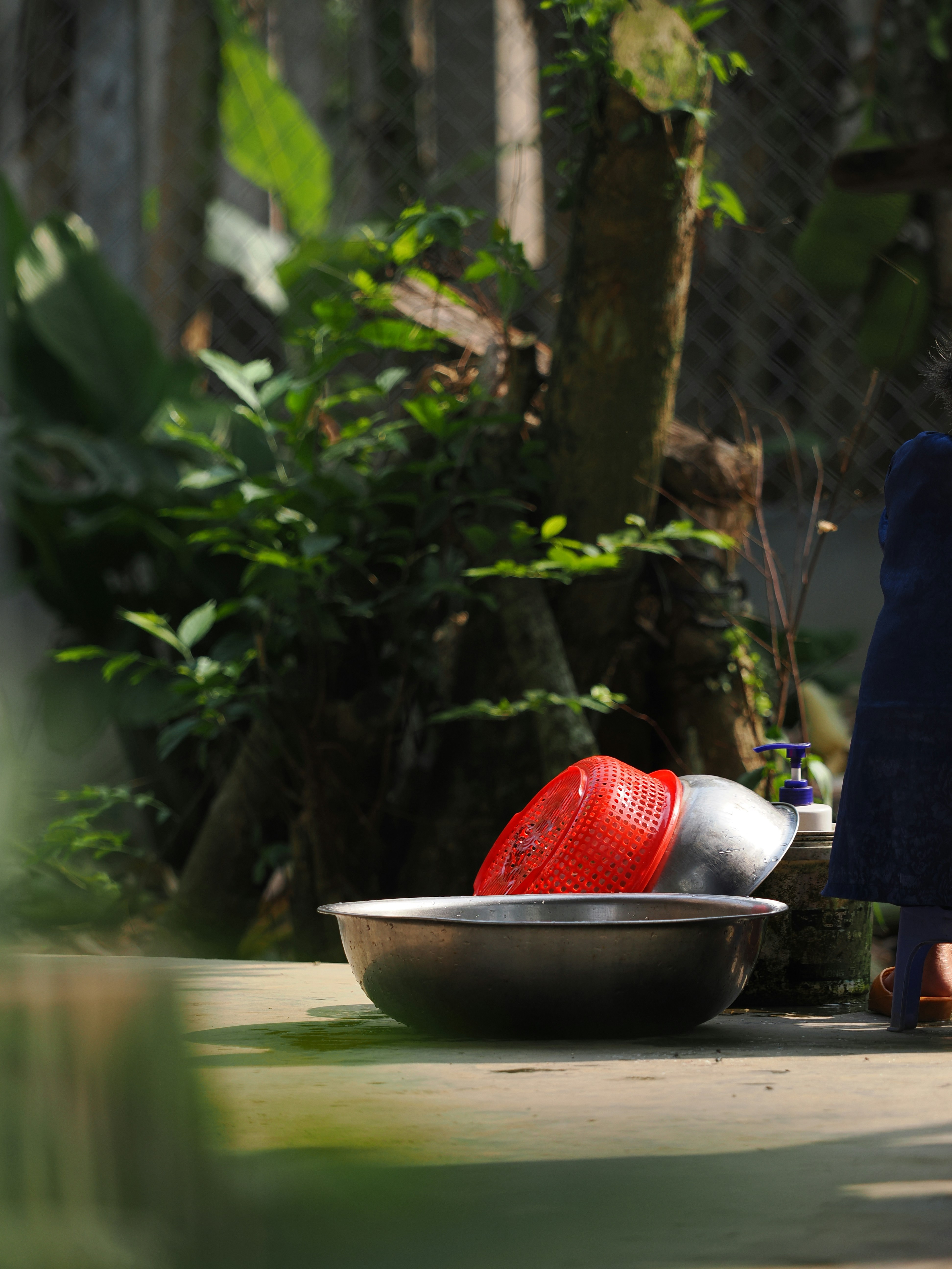 Bowls and colander on a table outdoors