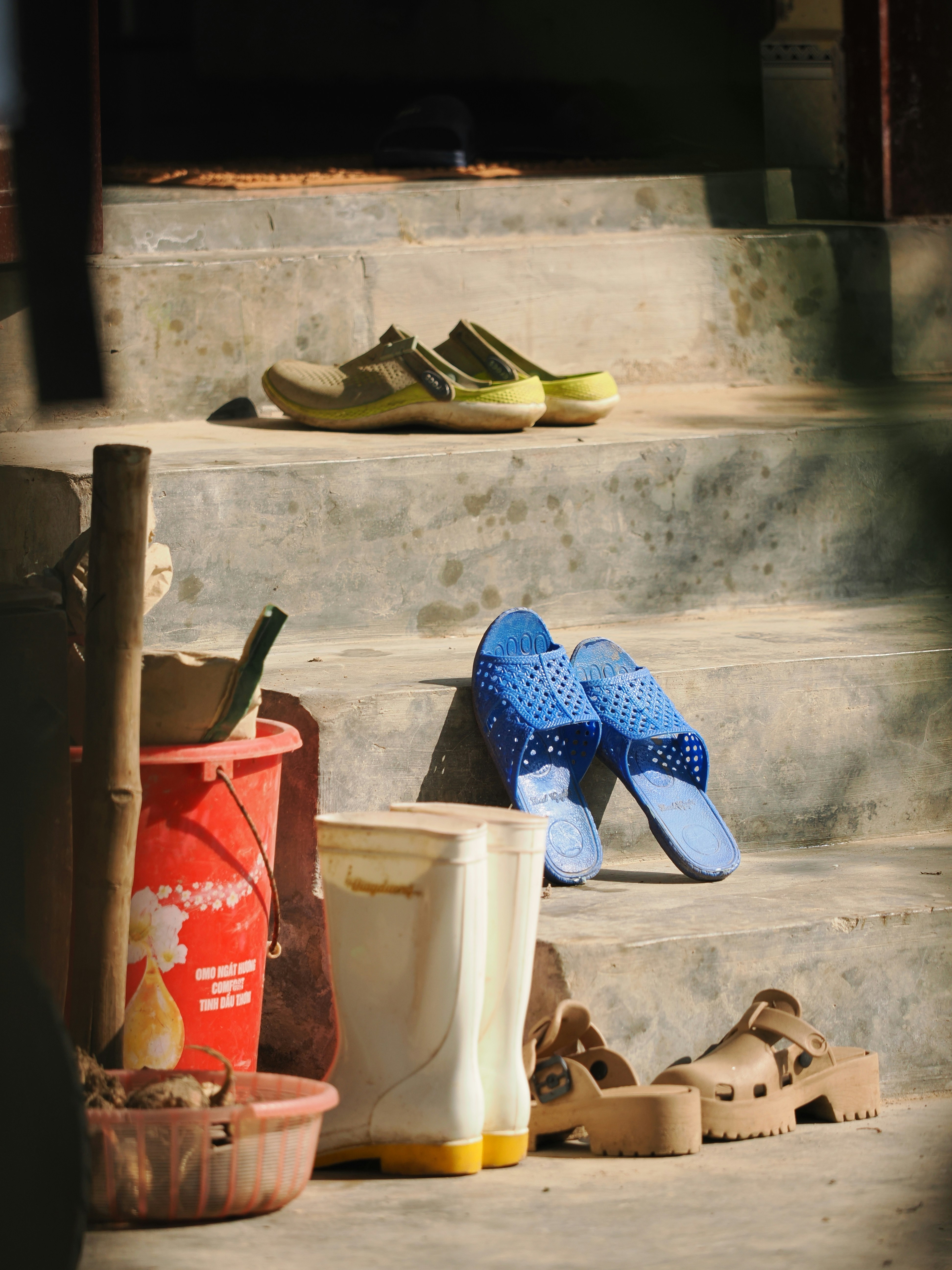 Steps to Shade: Bare Shoes and Rainy Cohort on Weathered Steps