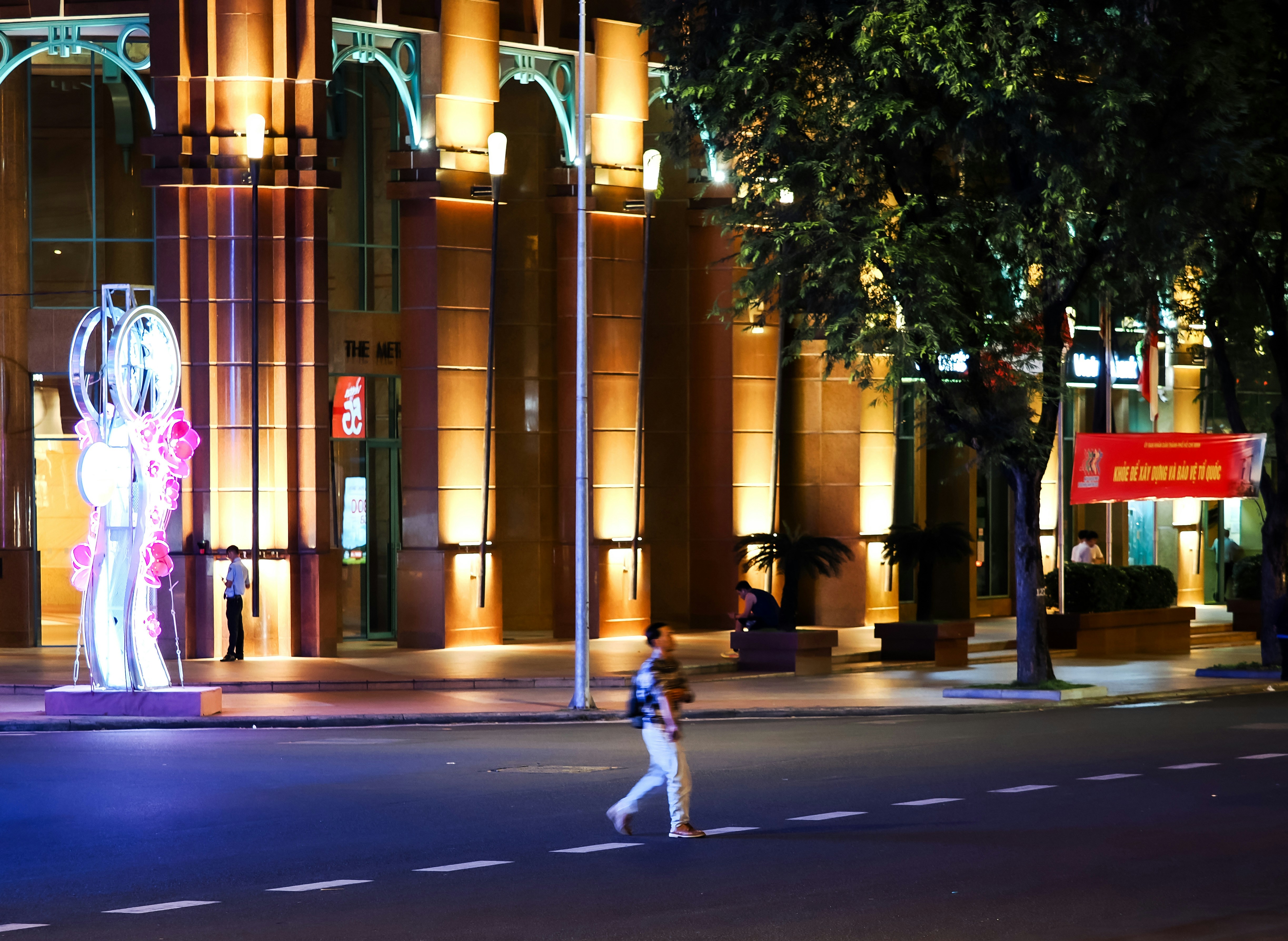 Neon Figures and Nightwalker on a Velvet Avenue