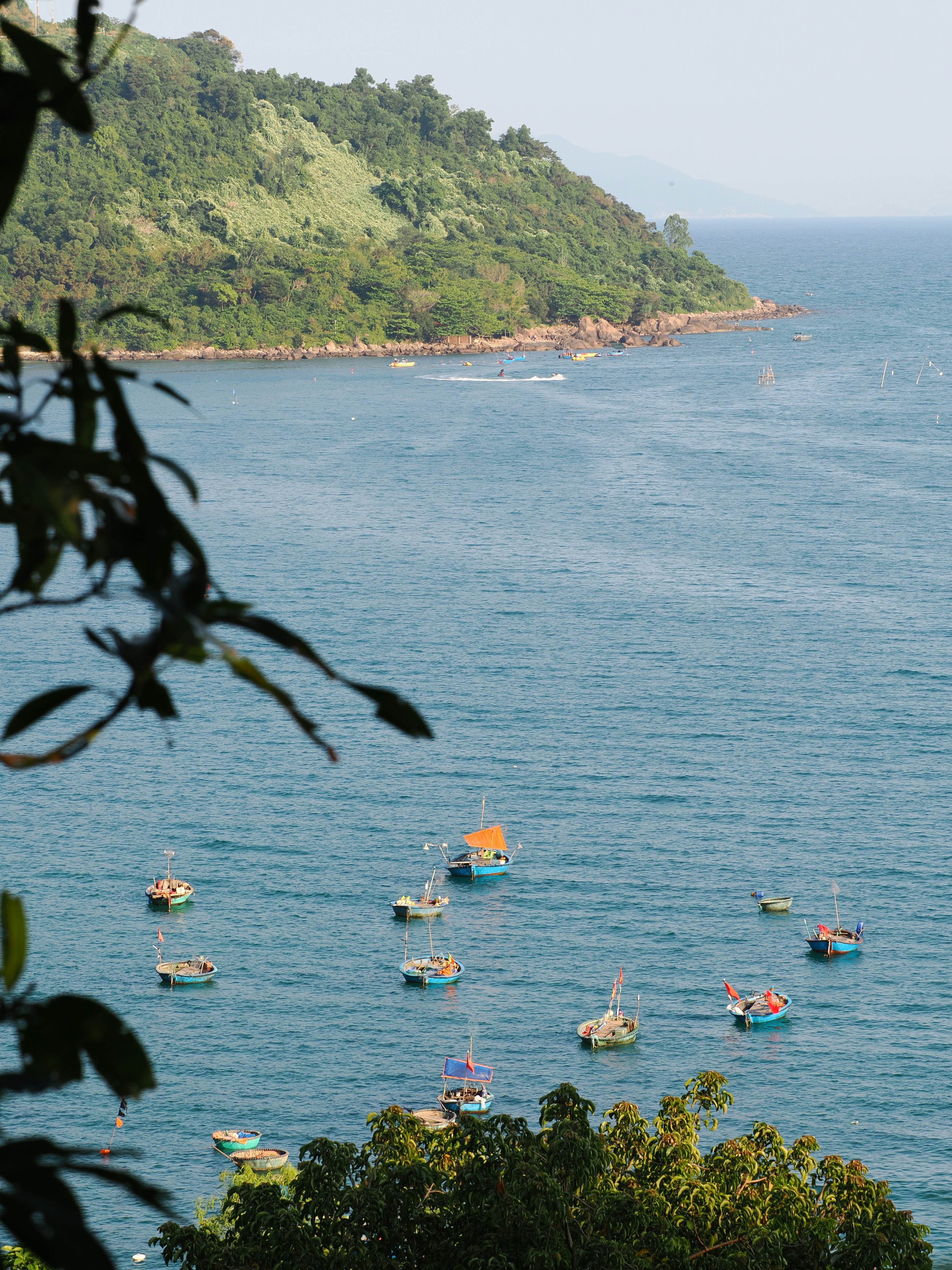 Coastal Boats at Dusk: A Quiet Harbour Between Green Slopes
