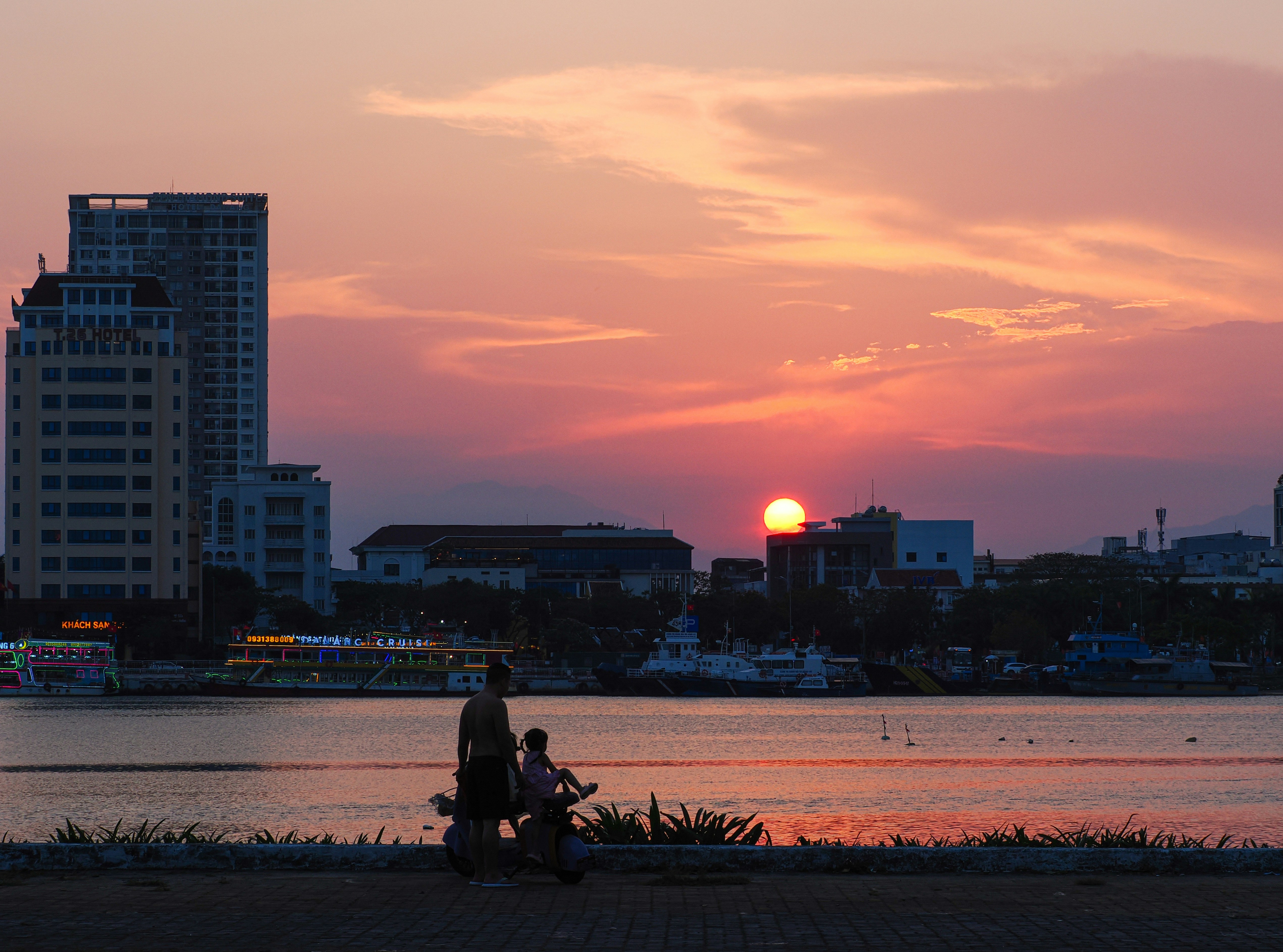 Sunset by the Riverside: Quiet Moment with a Couple