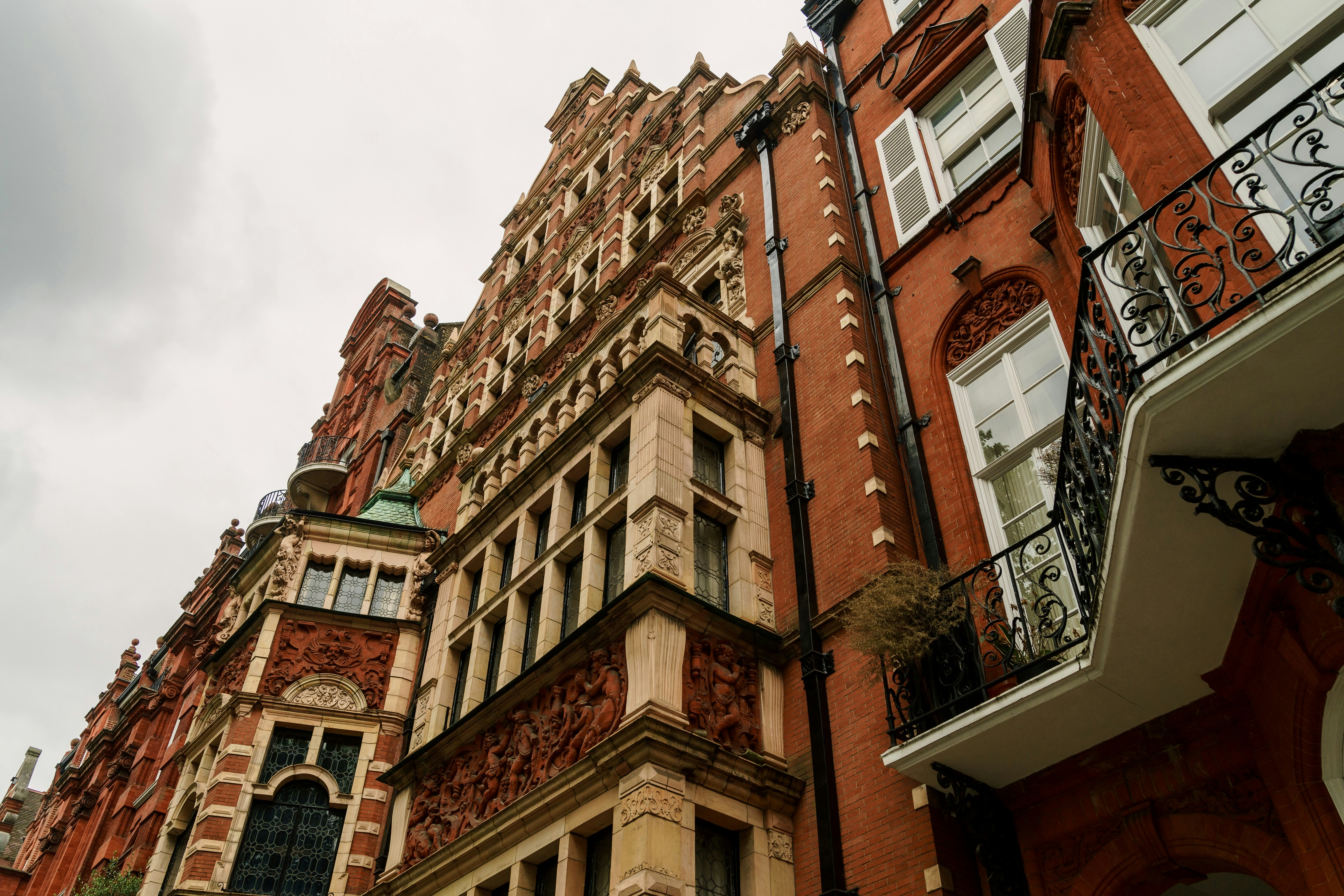 Gothic Revival Facade Ascending the Red Brick Skyline