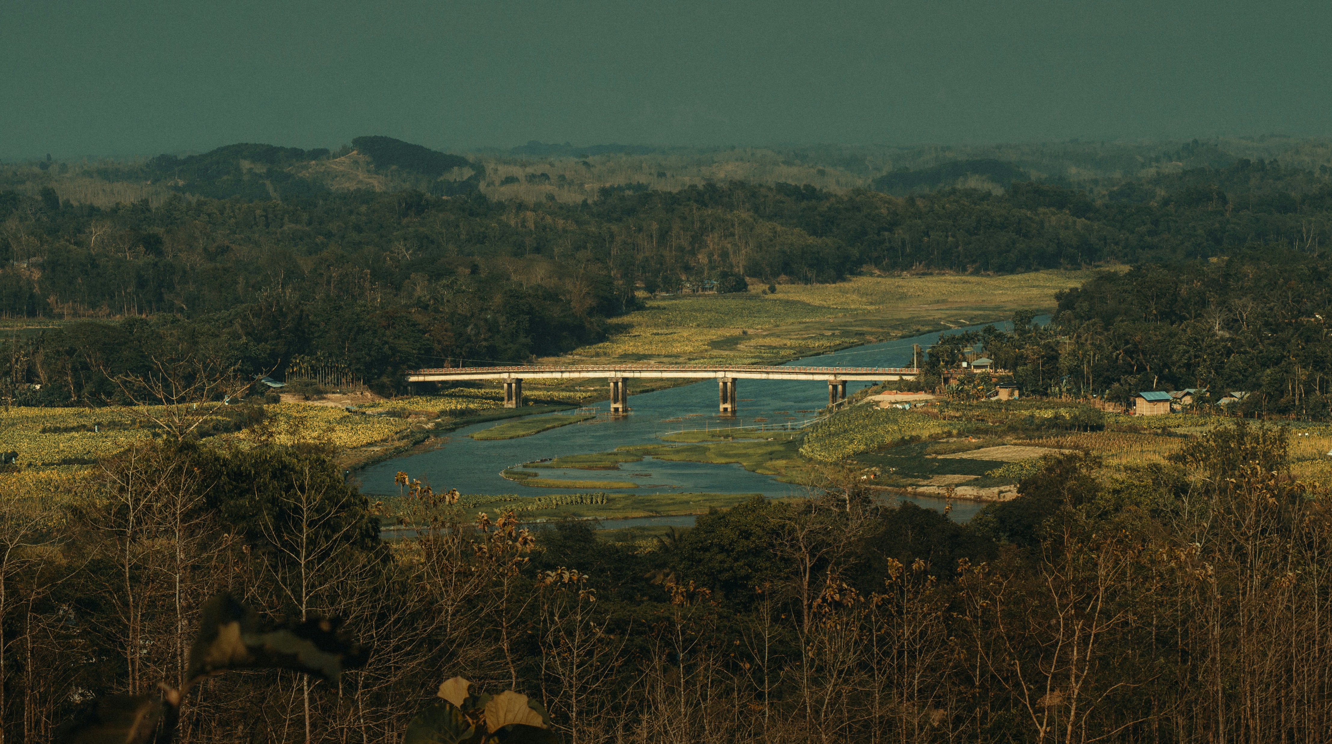Bridge over a Quiet River: A Panorama of Distant Hills