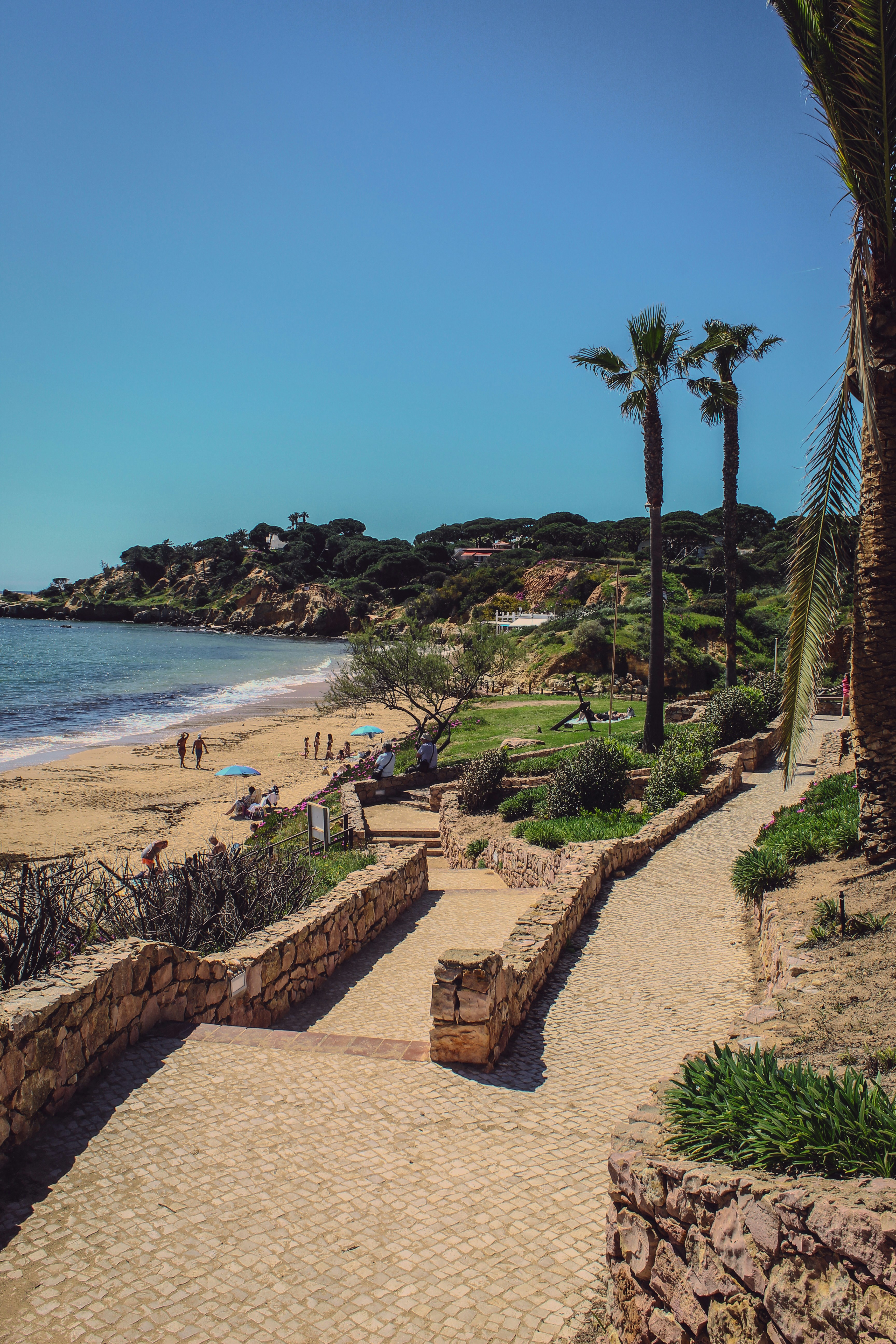 Sunlit Promenade by the Mediterranean Beach