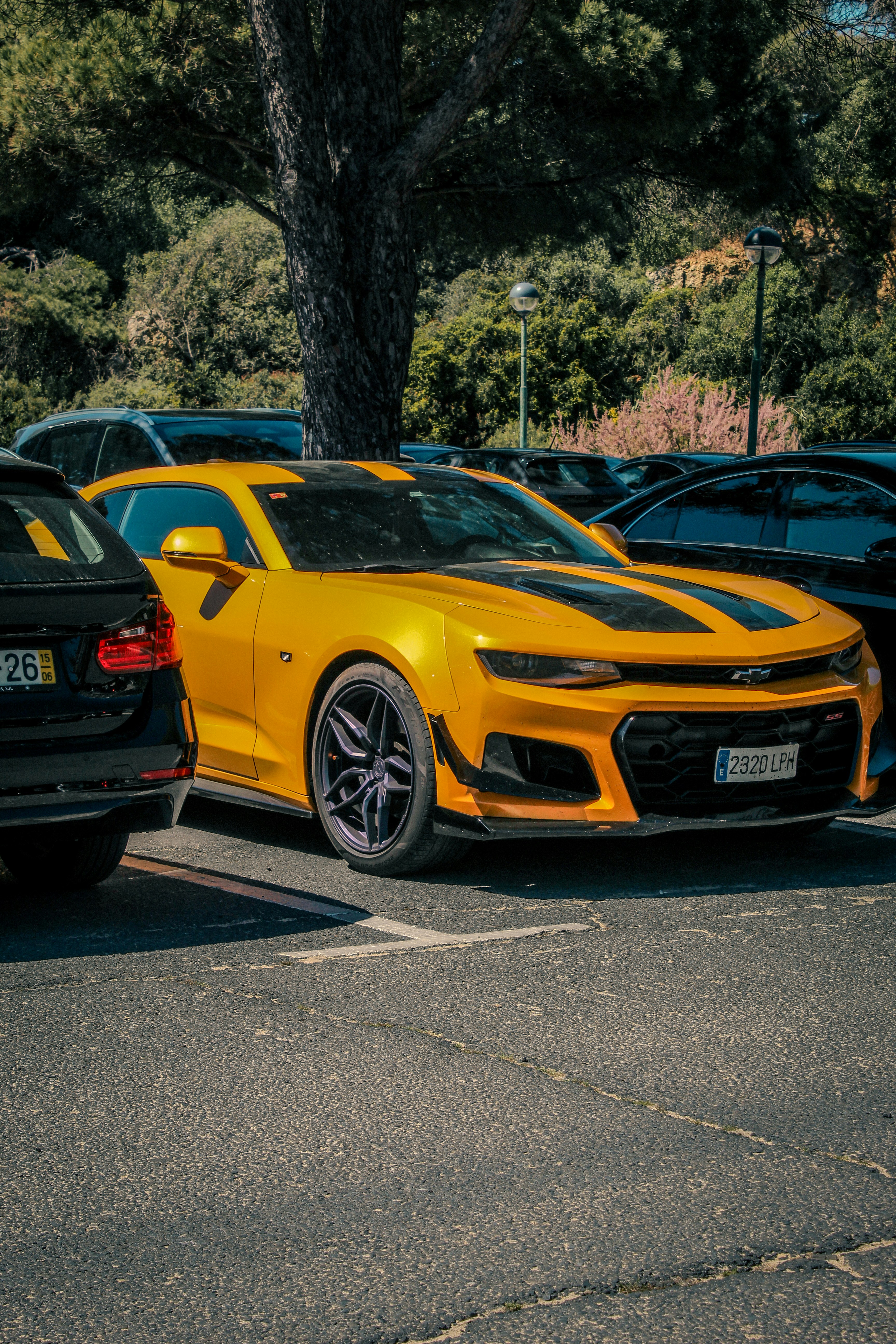 Yellow Chevelle in a Parking Lot: Street Glow and Dark Stripes