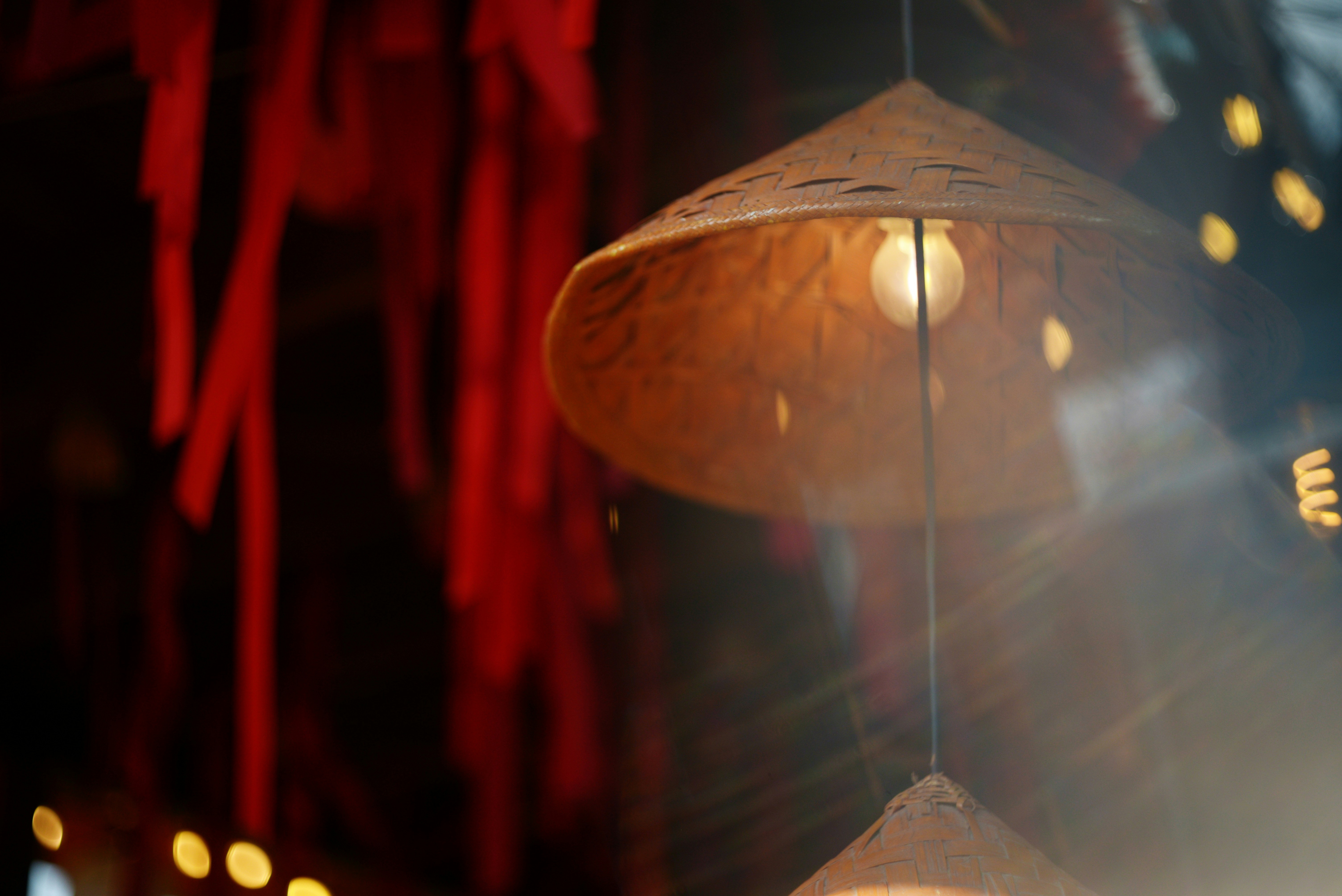 Lanterns and Straw Hats: Quiet Light in a Red-Threaded Night Market