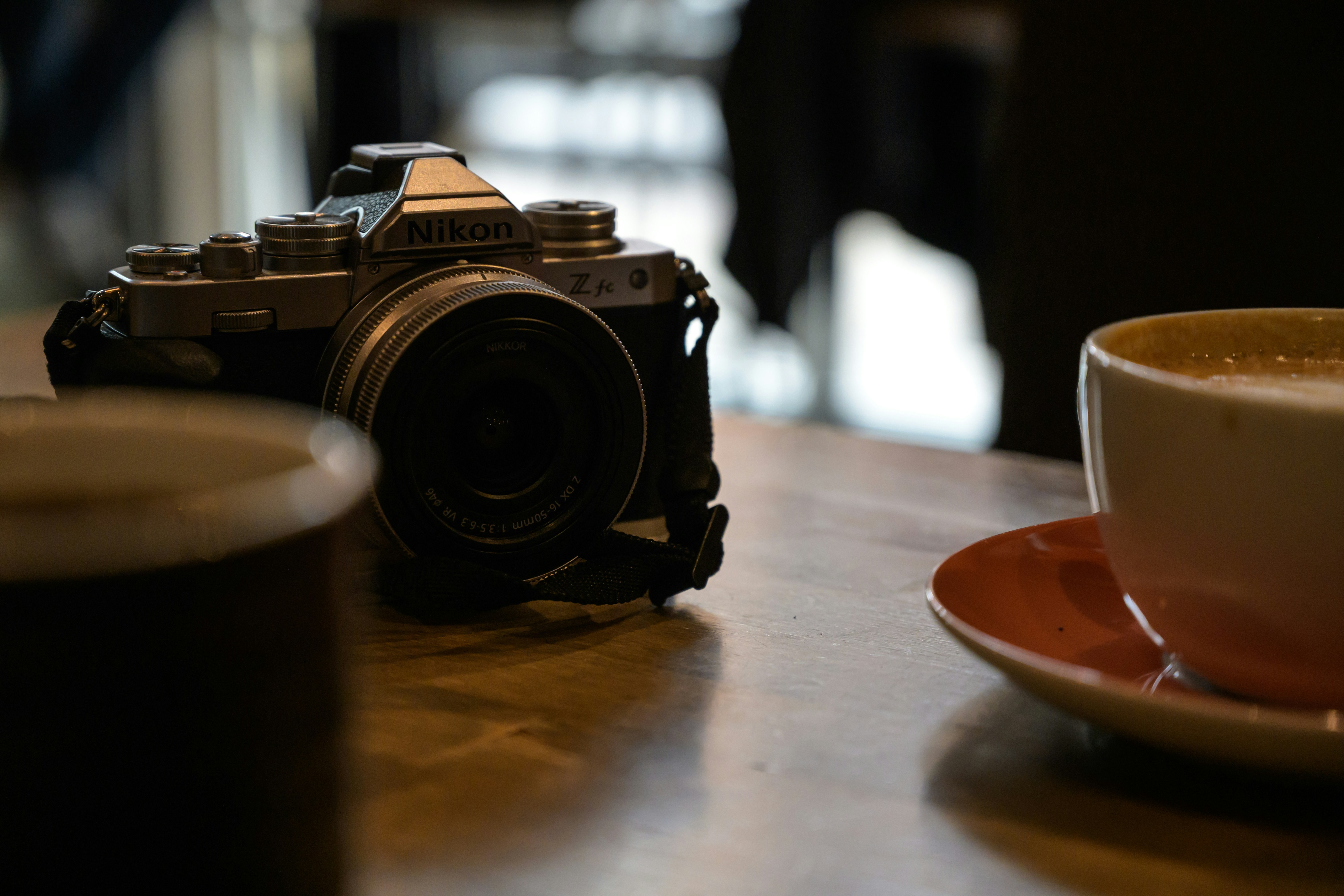 Retro Precision: A Quiet Espresso Moment with a Nikon on a Sunlit Table