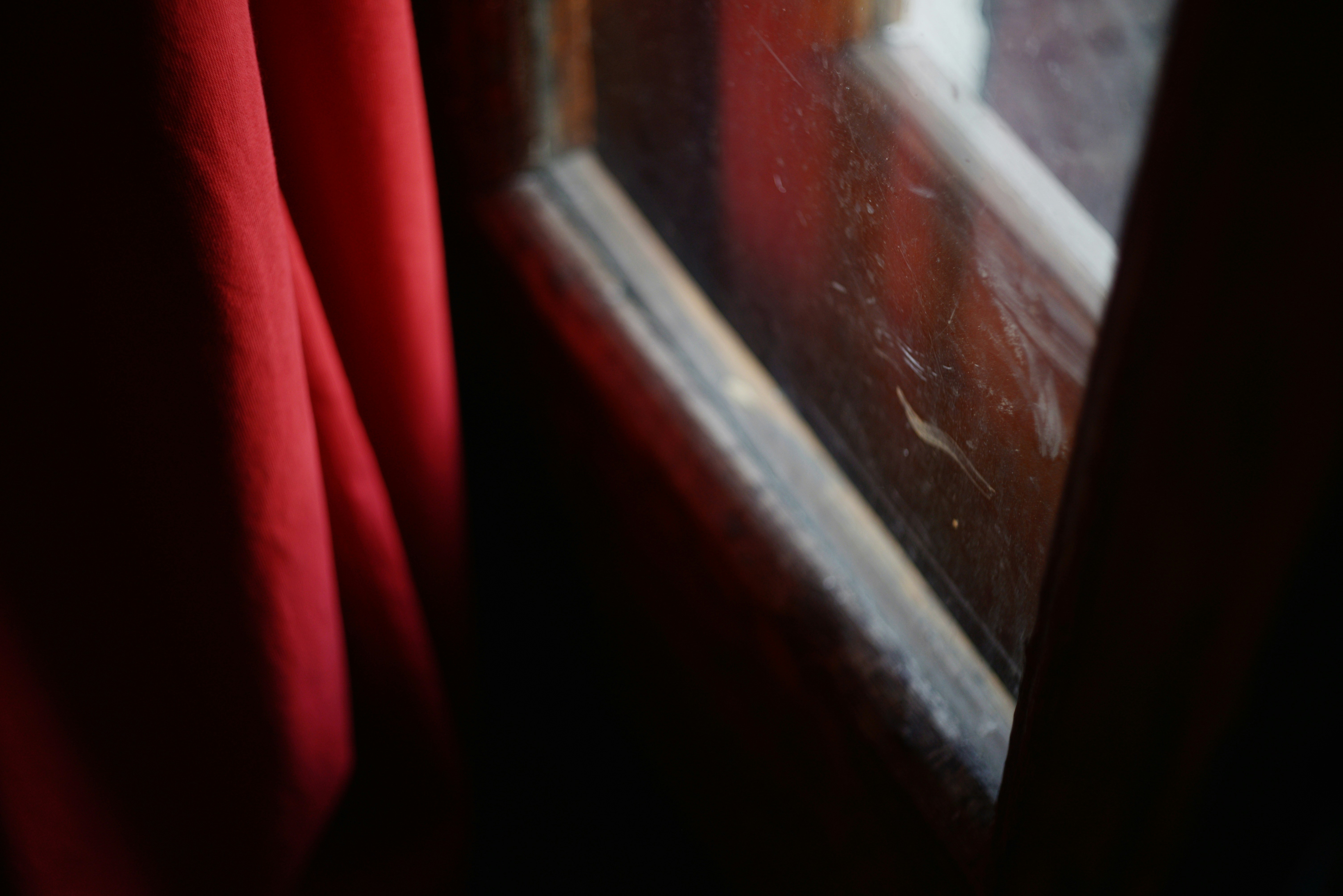 Red Curtain Valleys: A Quiet Window Corner