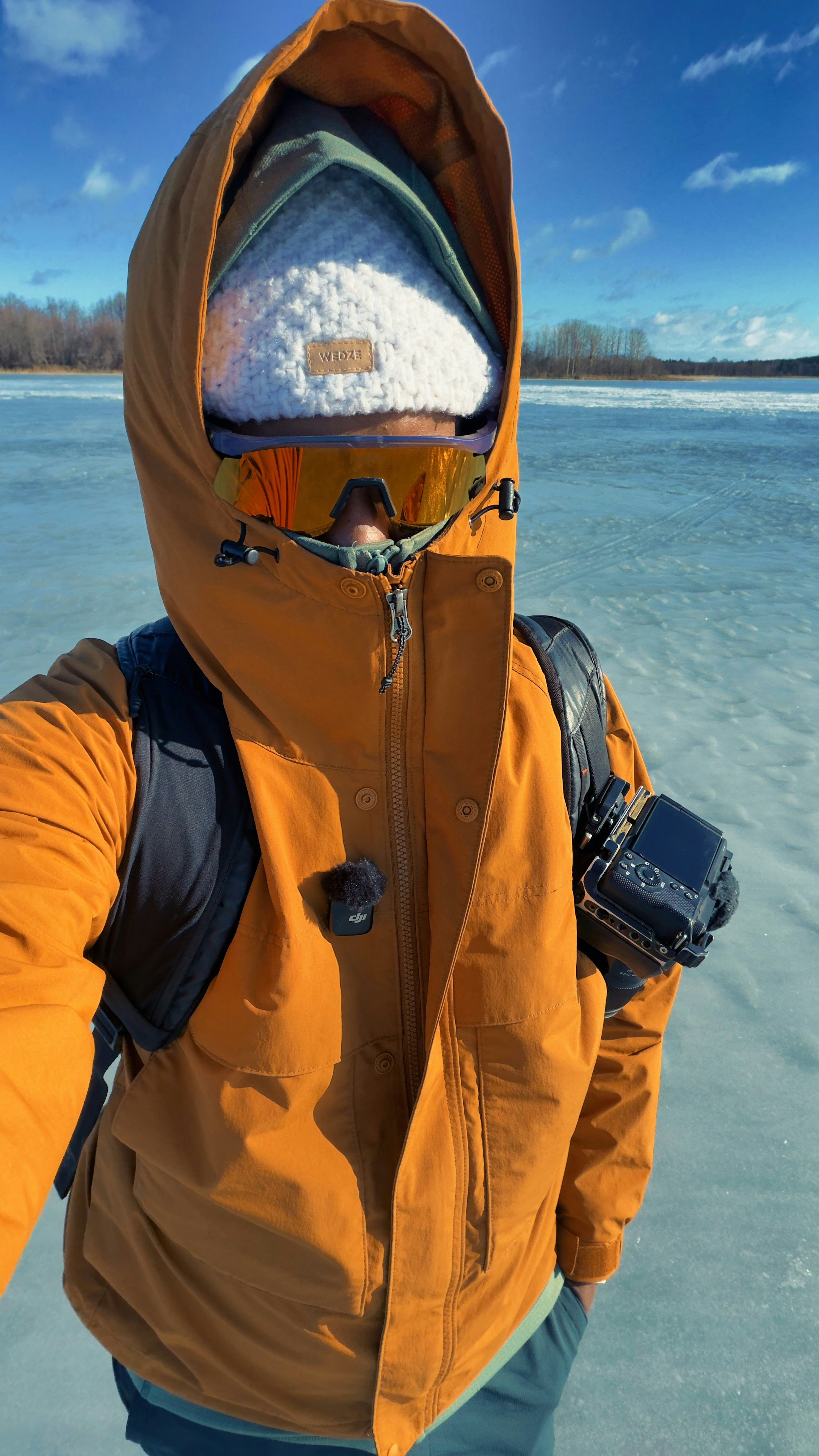 Orange Parka in Frosty Backdrop: Selfie on a Frozen Lake