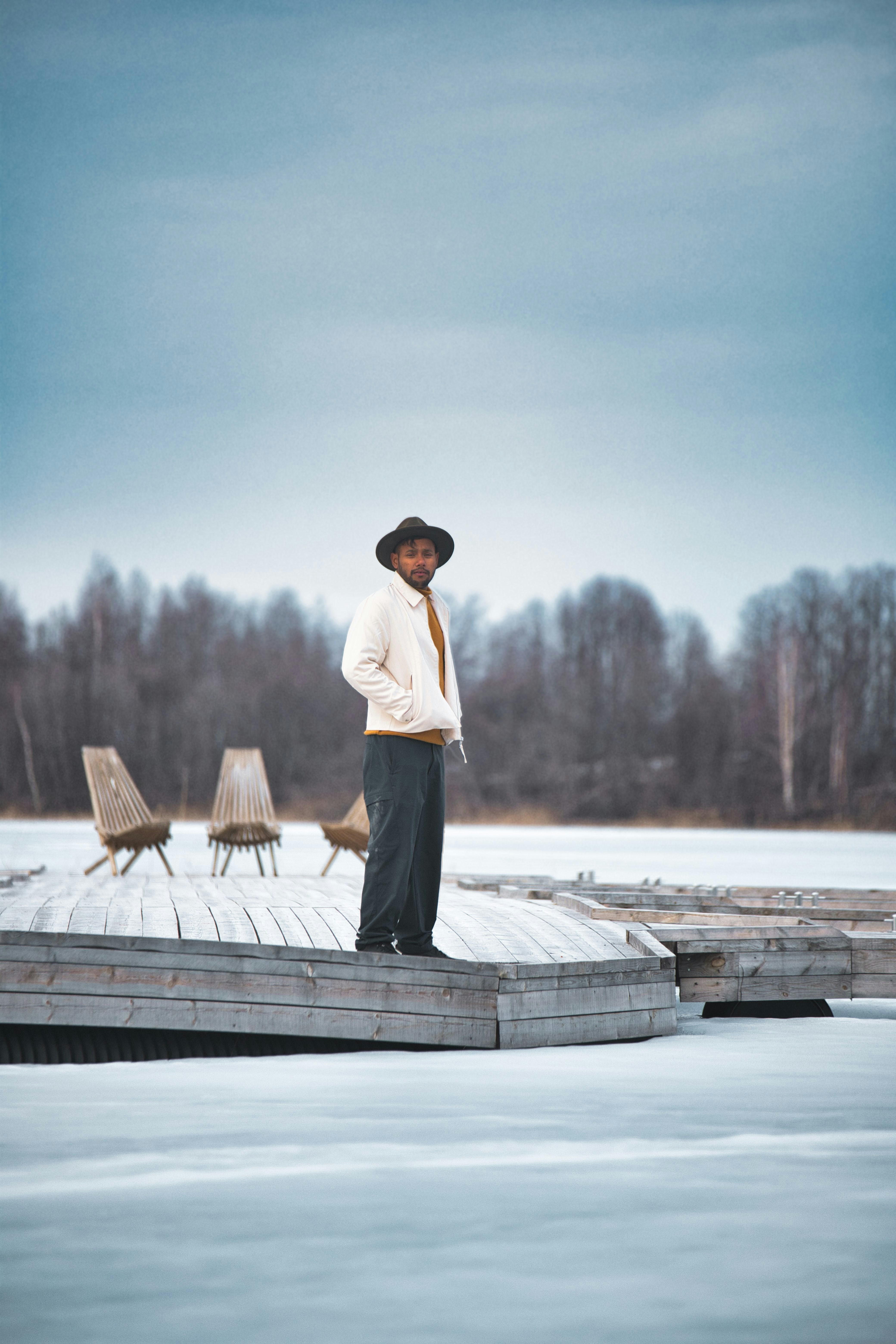 Man on a Quiet Lake Dock, Winter Light and Soft Majesties