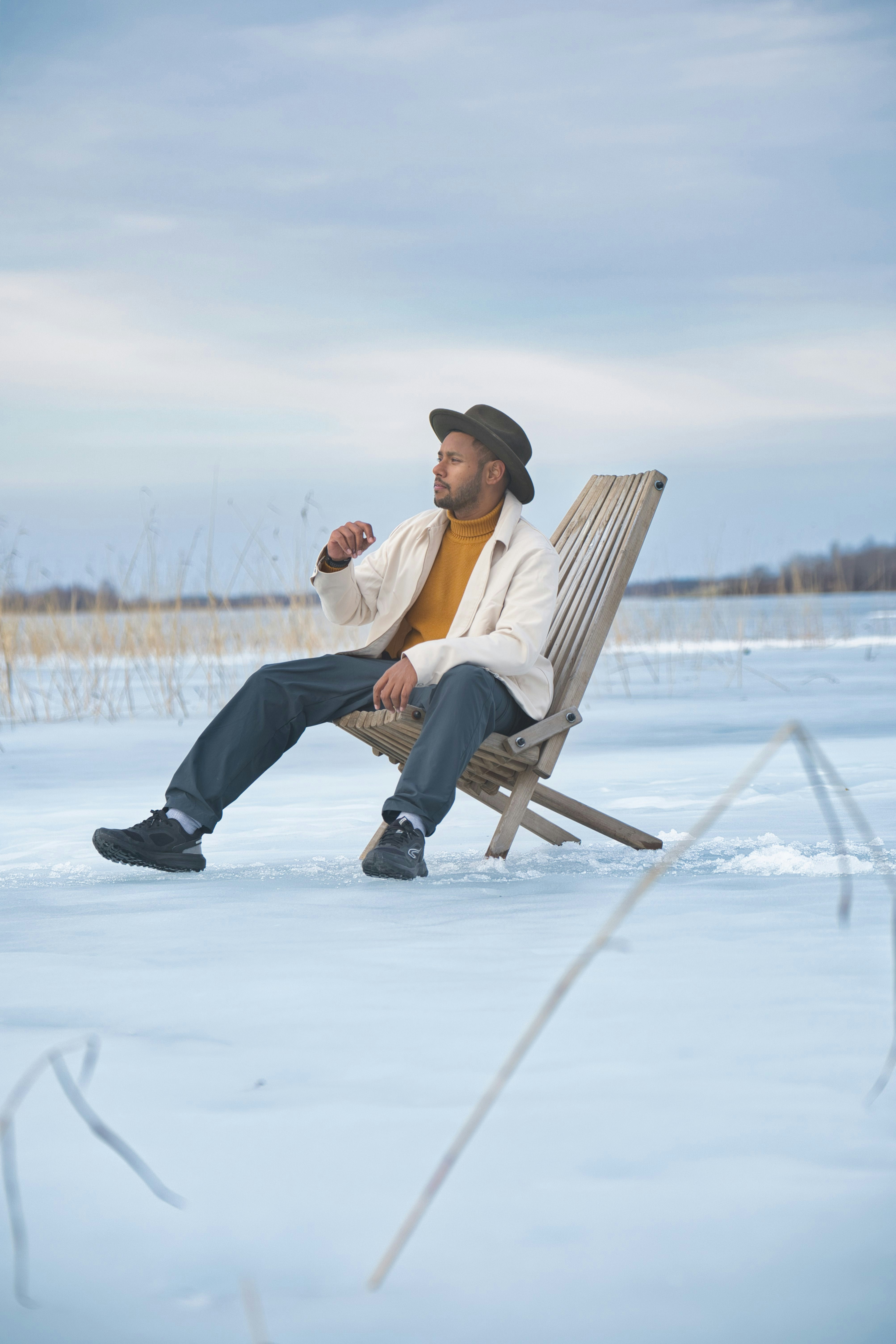 Solo by the frozen shoreline: a contemplative moment in winter light