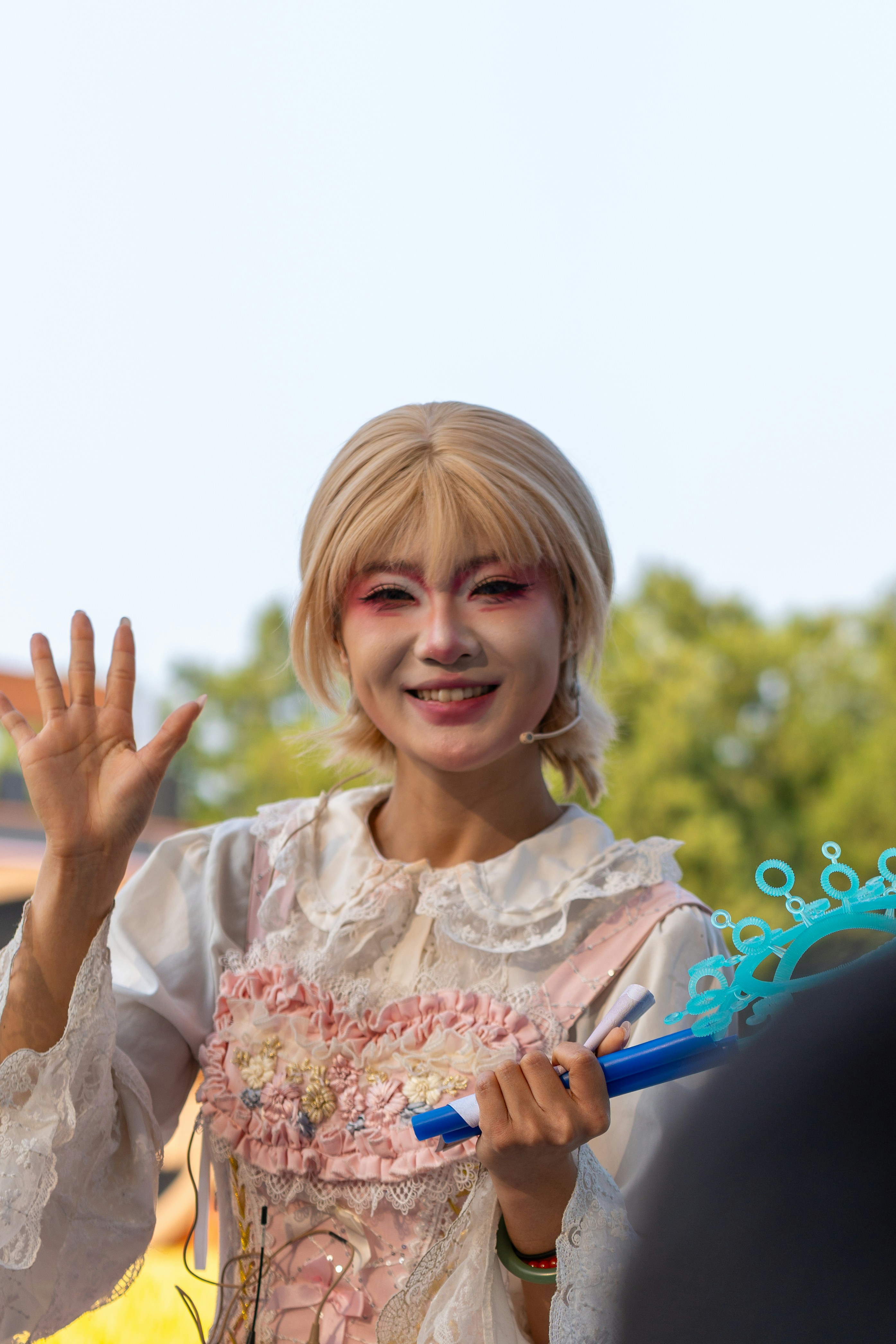 Cheerful Wave: A Cosplay Moment in Soft Pastels