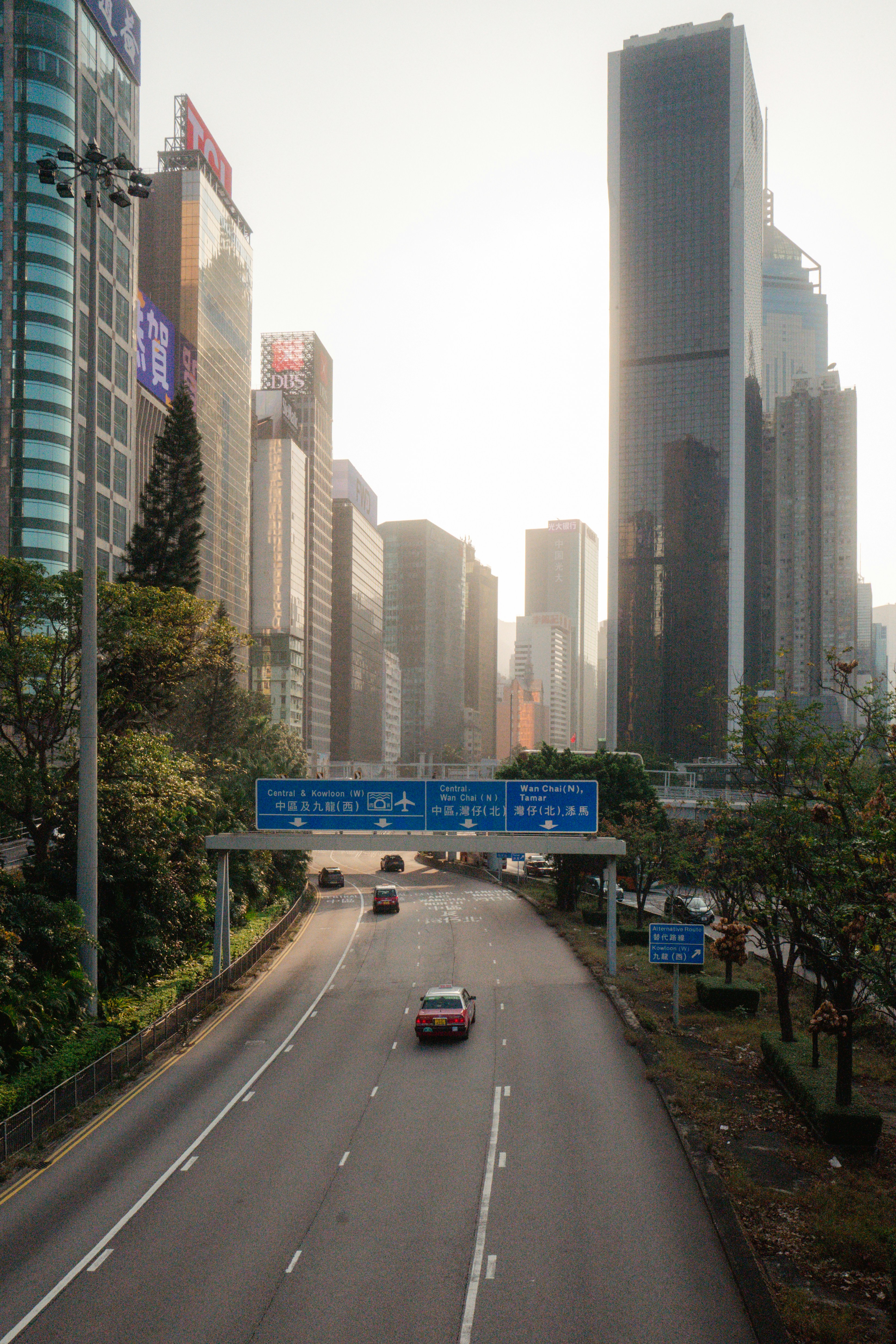 Urban Ribbon: Cars Glide Beneath a Canopy of Skyscrapers