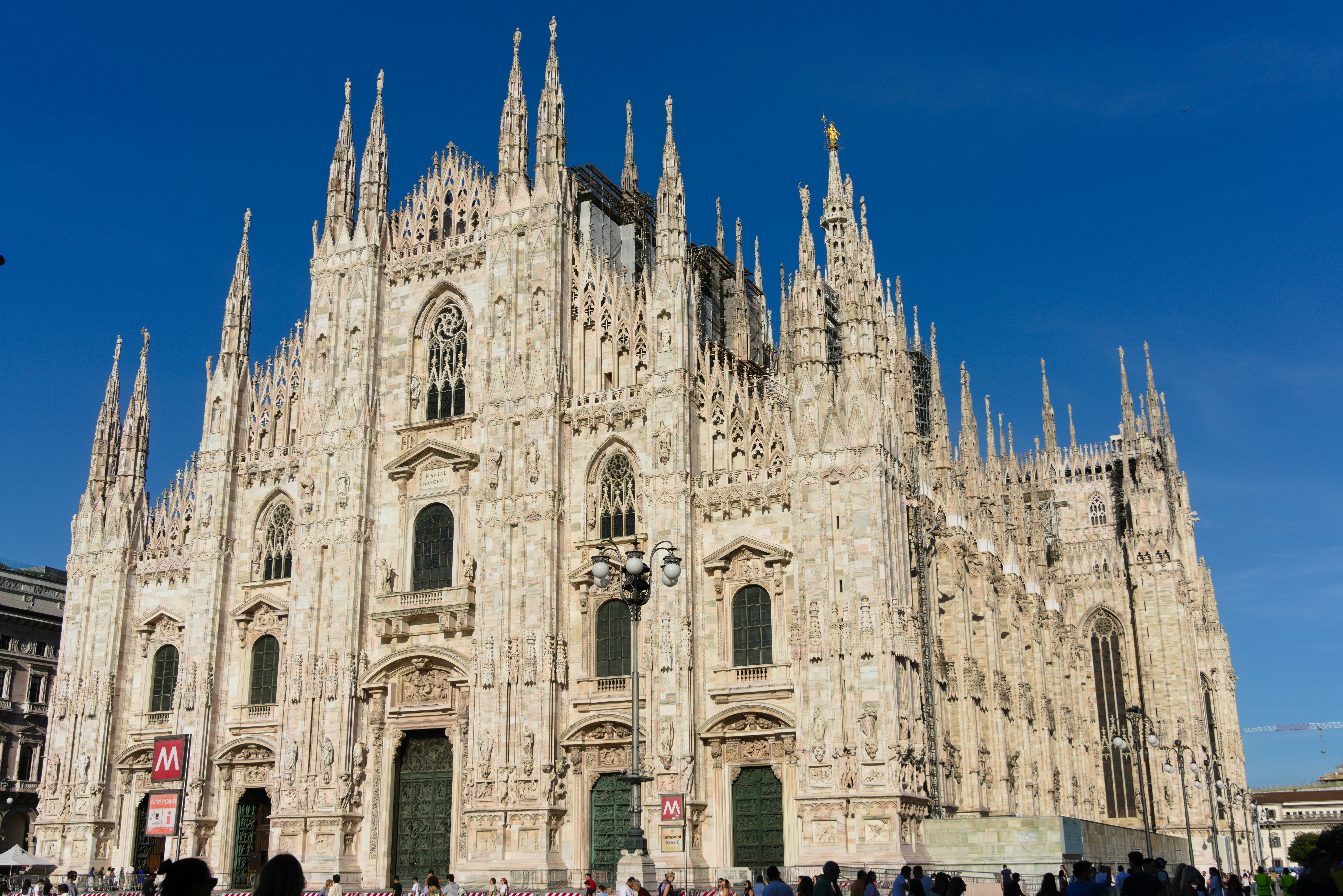 Gothic Grandur: The Milan Cathedral Facade Rising Above the Square